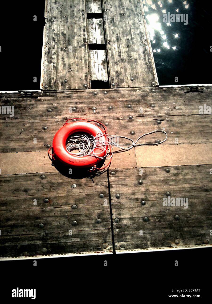 Rescue buoy on dock Stock Photo - Alamy