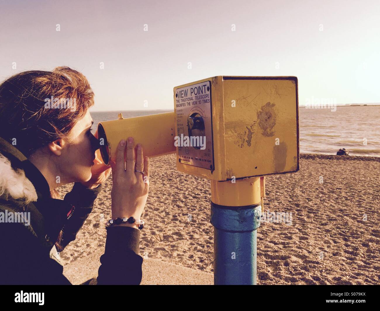 Woman telescope sea hi-res stock photography and images - Alamy