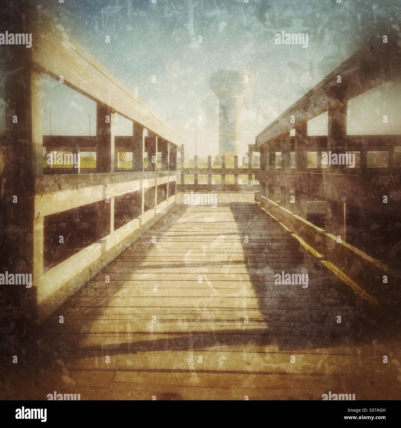 A pier overlooking a water tower Stock Photo - Alamy