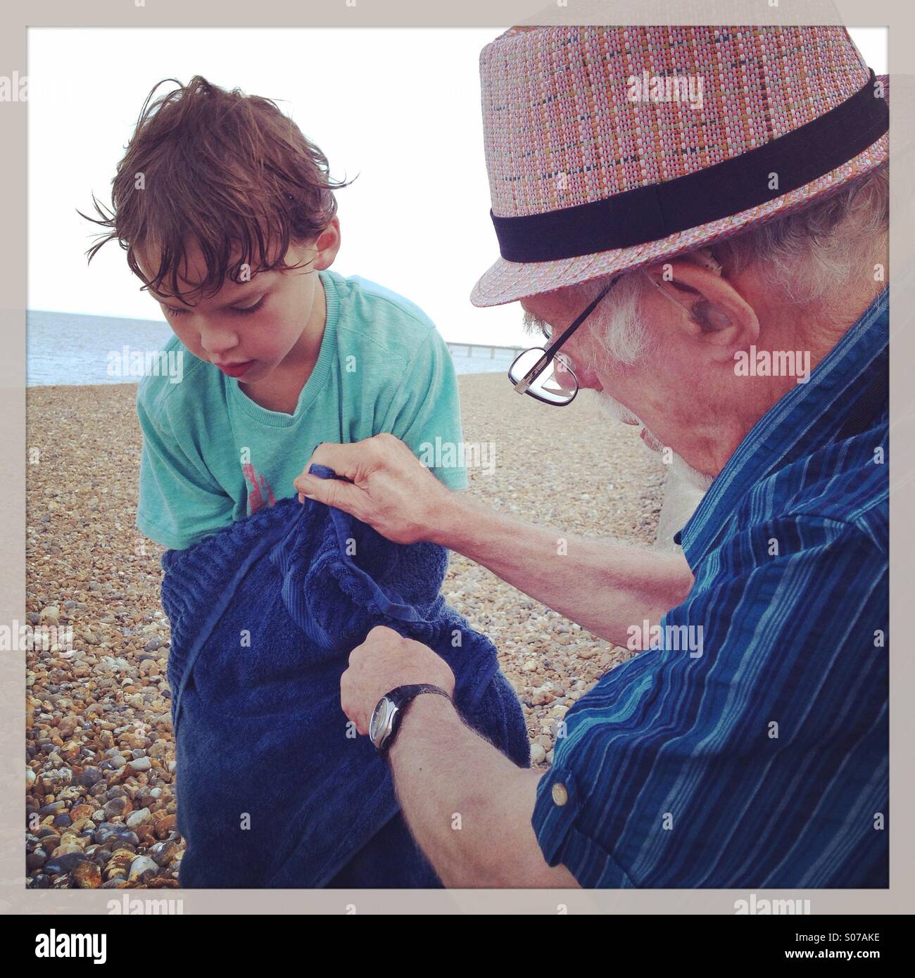 Helping boy hi-res stock photography and images - Alamy