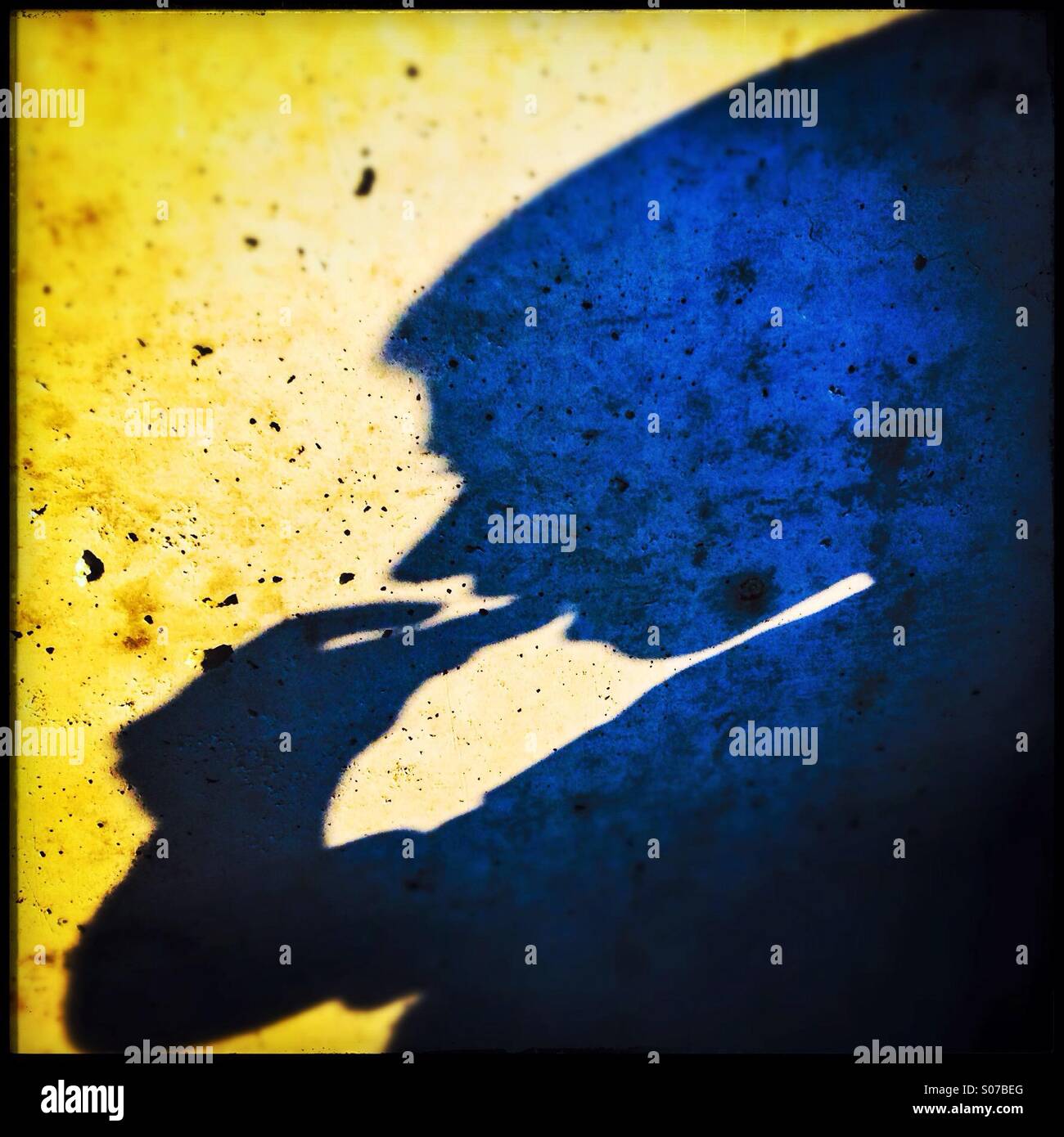 Shadow of a young boy eating Stock Photo - Alamy