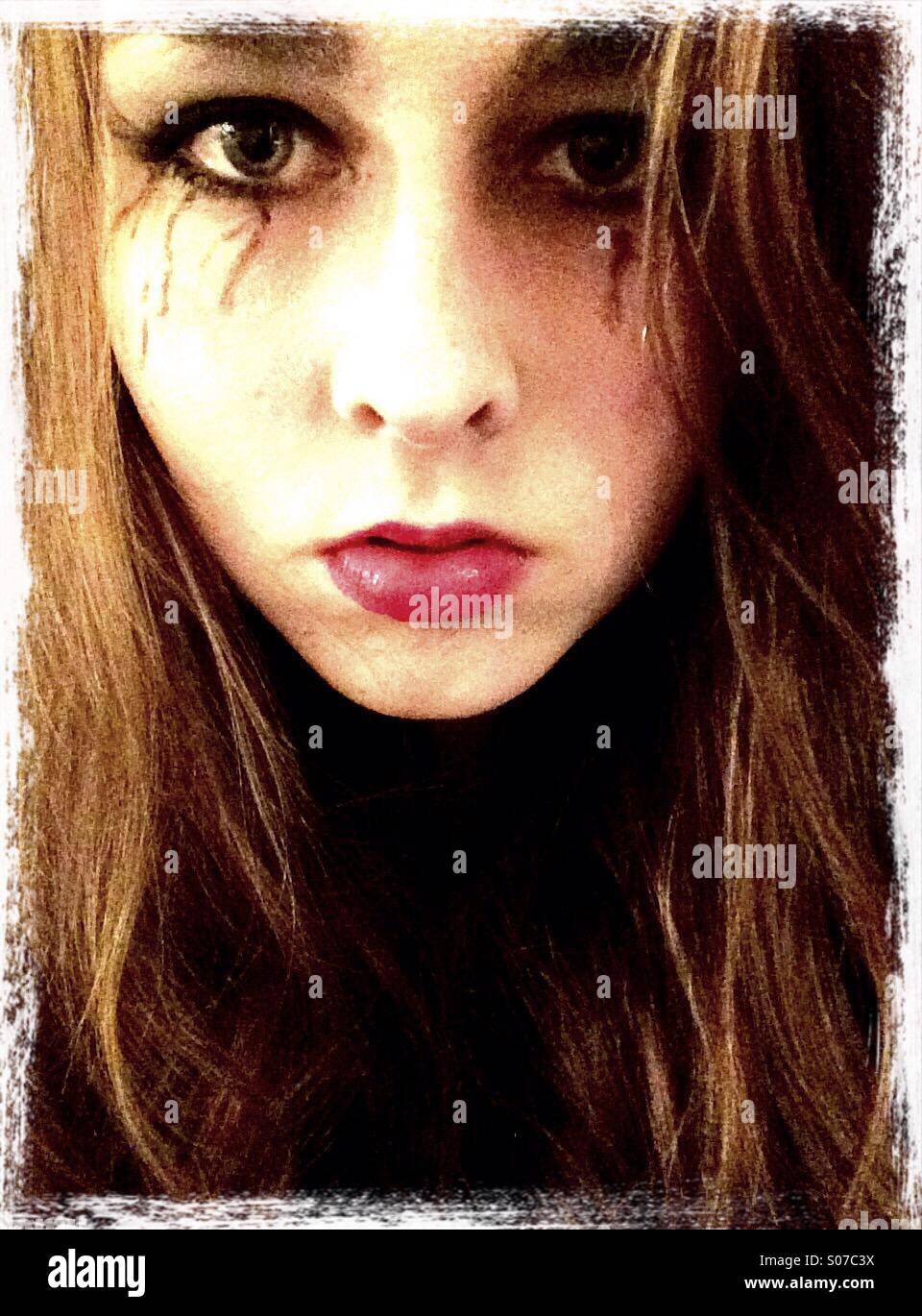 Teenage girl with threatening look and scary makeup Stock Photo - Alamy