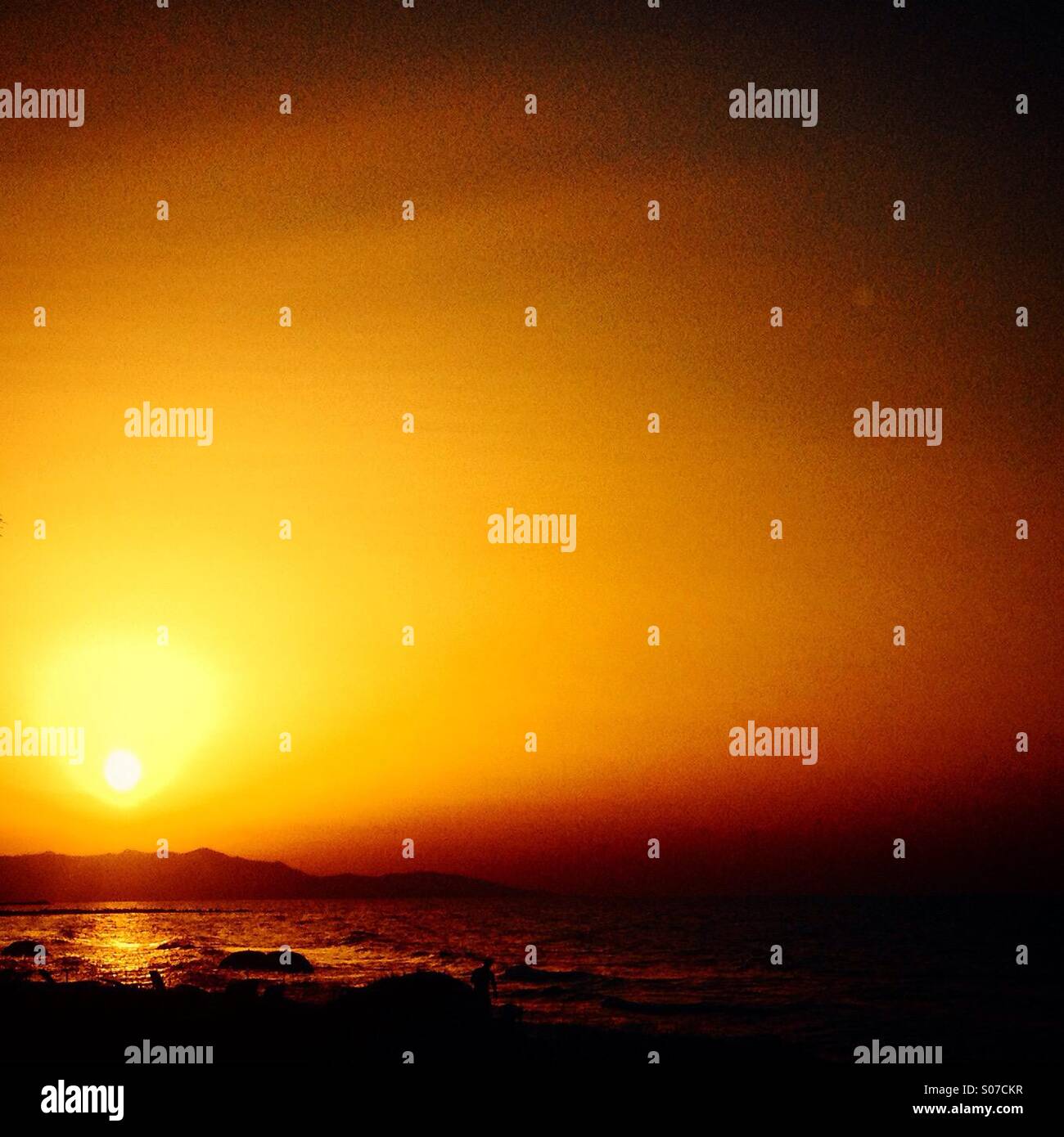 Sunset in Greece through car window whilst driving Stock Photo - Alamy