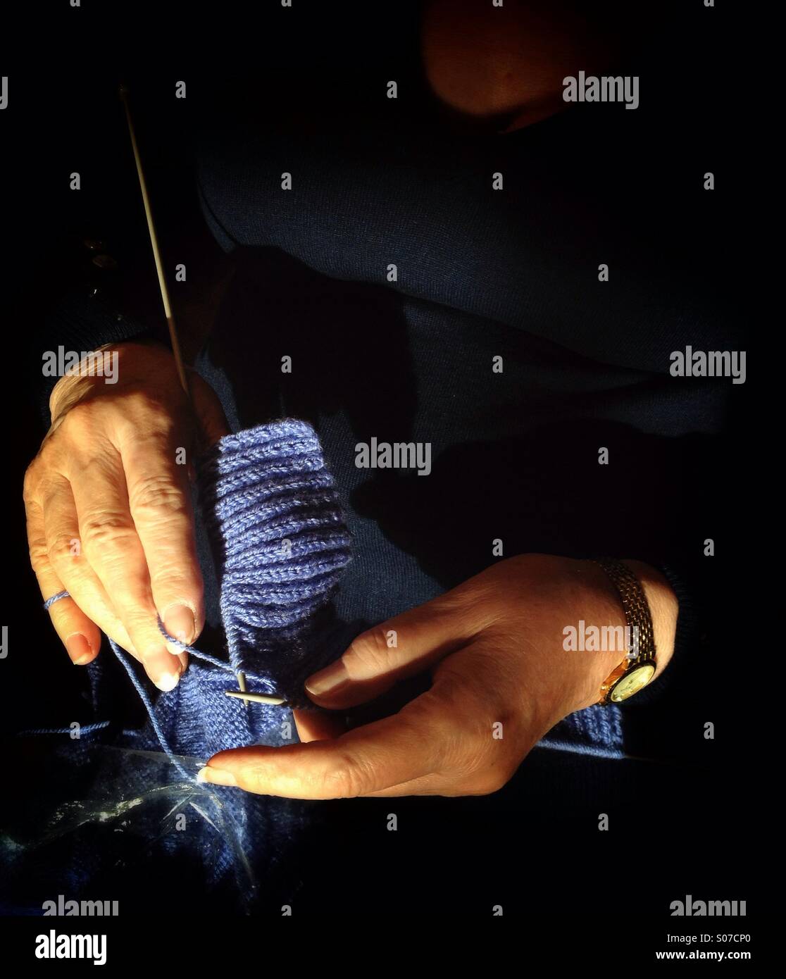 Womans hands knitting Stock Photo - Alamy