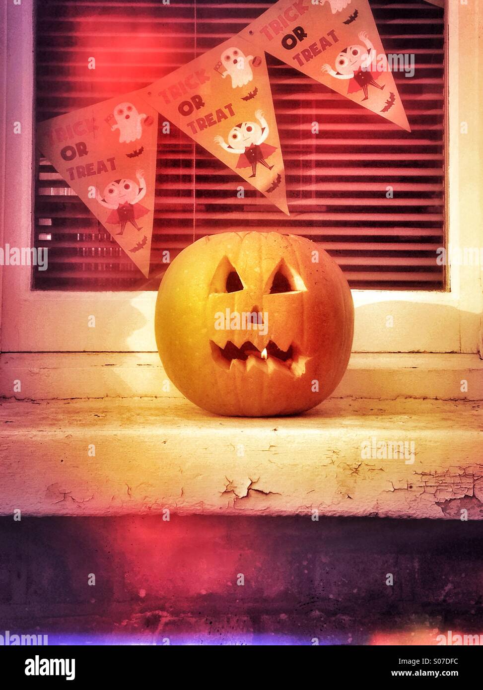 Trick or treat pumpkin window Stock Photo - Alamy