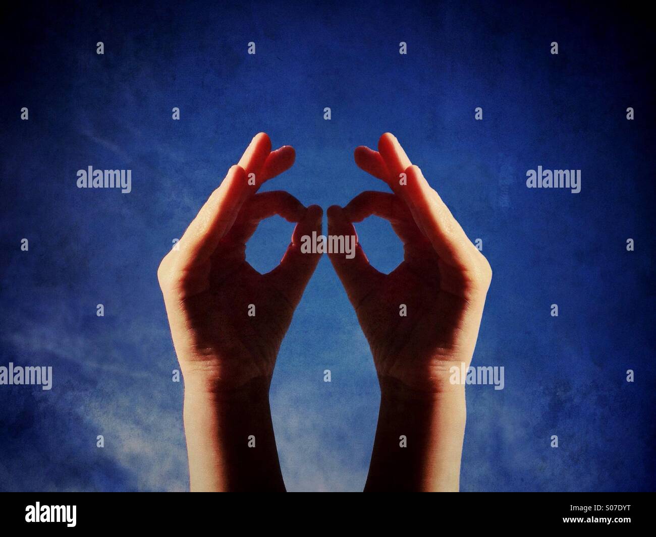 Child's hands showing sign for okay Stock Photo - Alamy