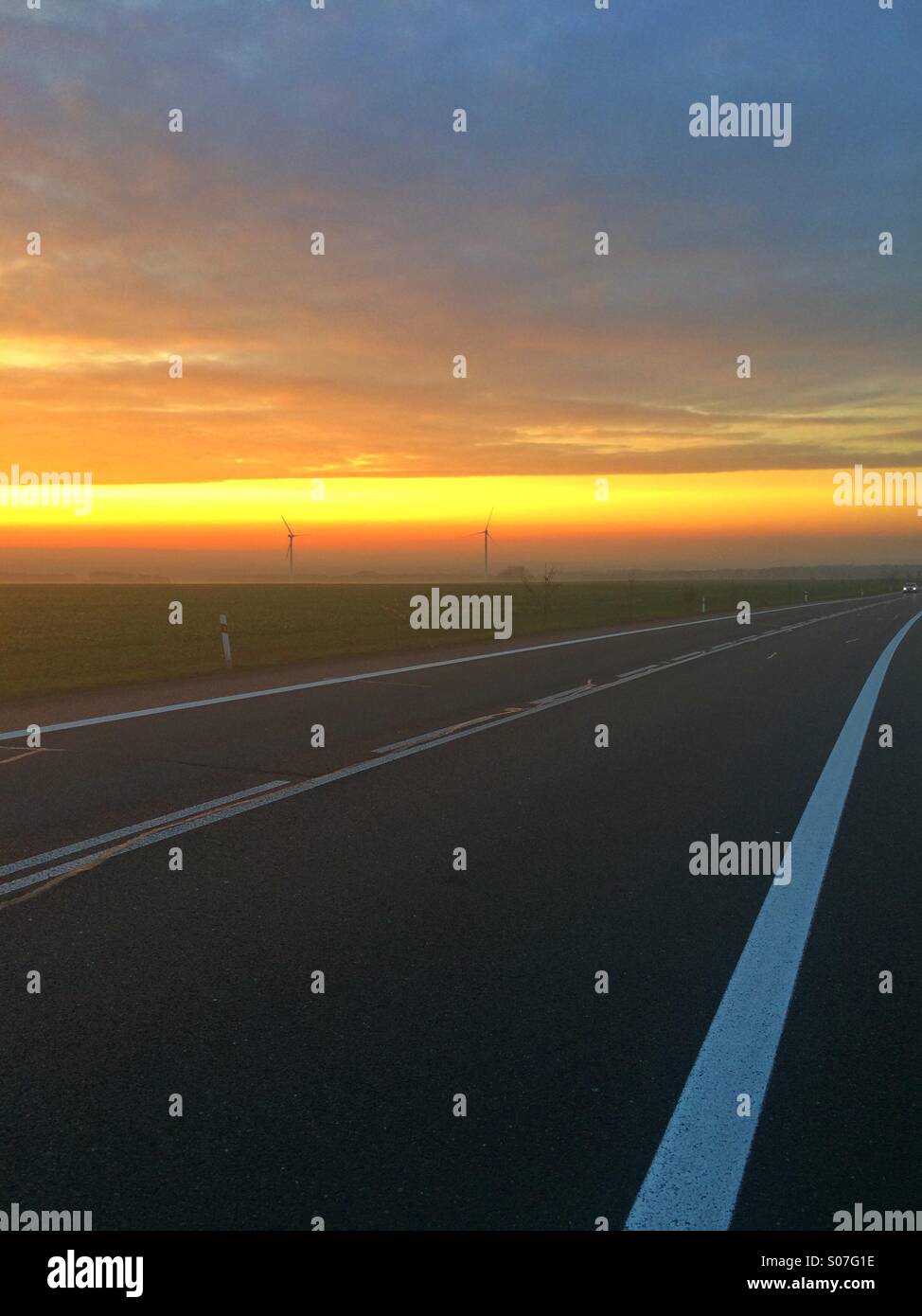 Empty road and dramatic sunset Stock Photo - Alamy