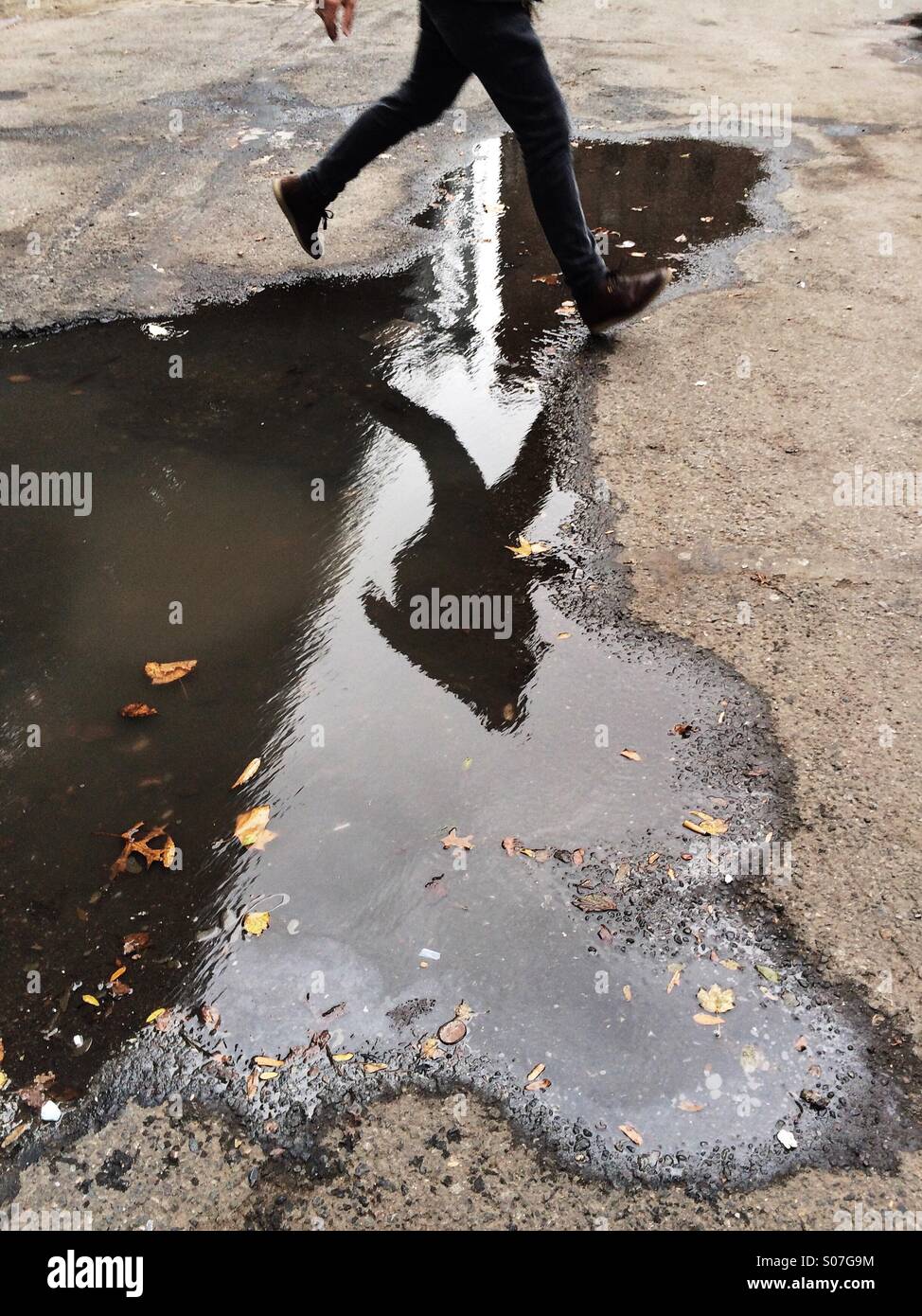 Puddle reflection jump hi-res stock photography and images - Alamy