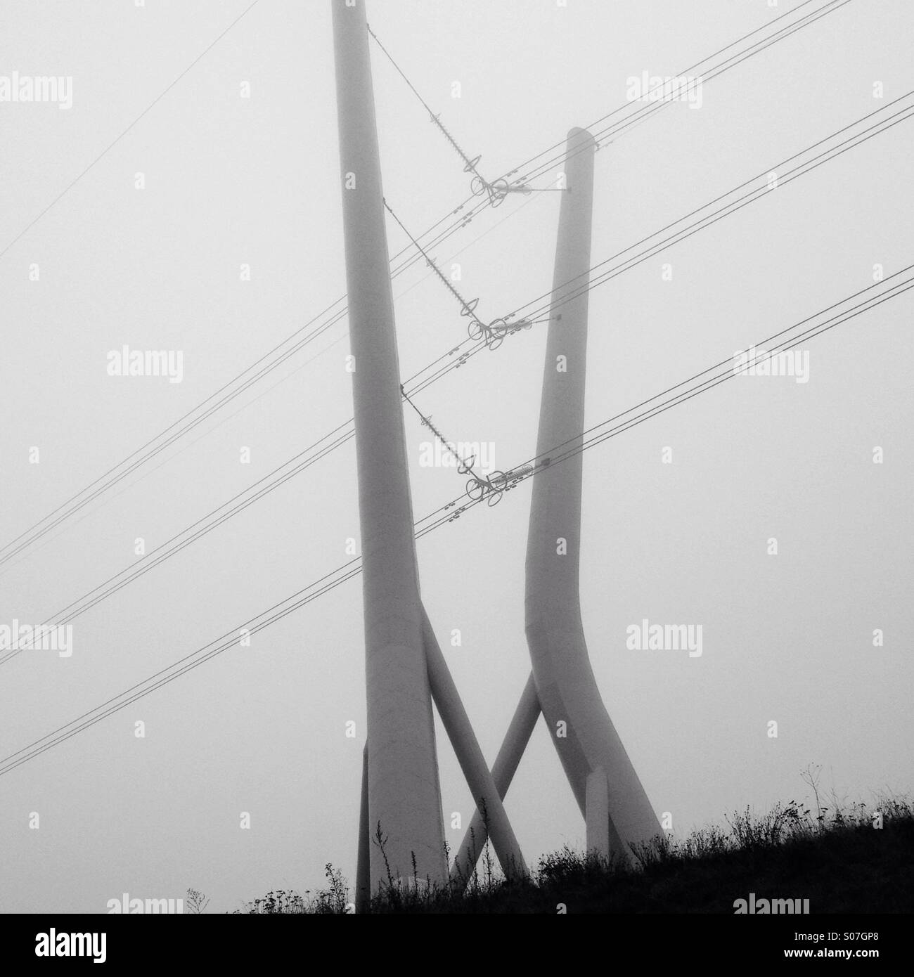 Pylons in the mist hi-res stock photography and images - Alamy