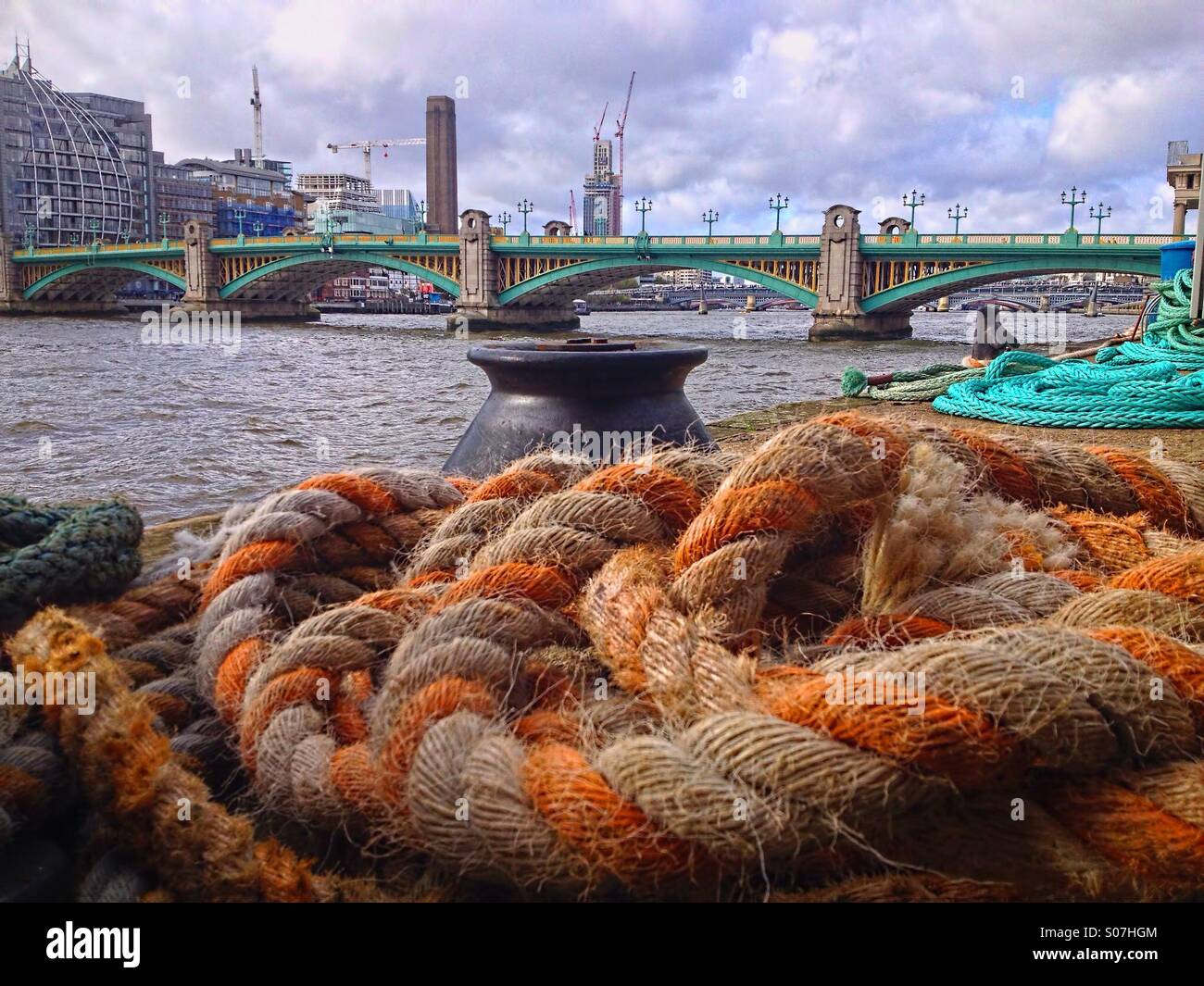 Dockside view of bridge across the Thames Stock Photo - Alamy