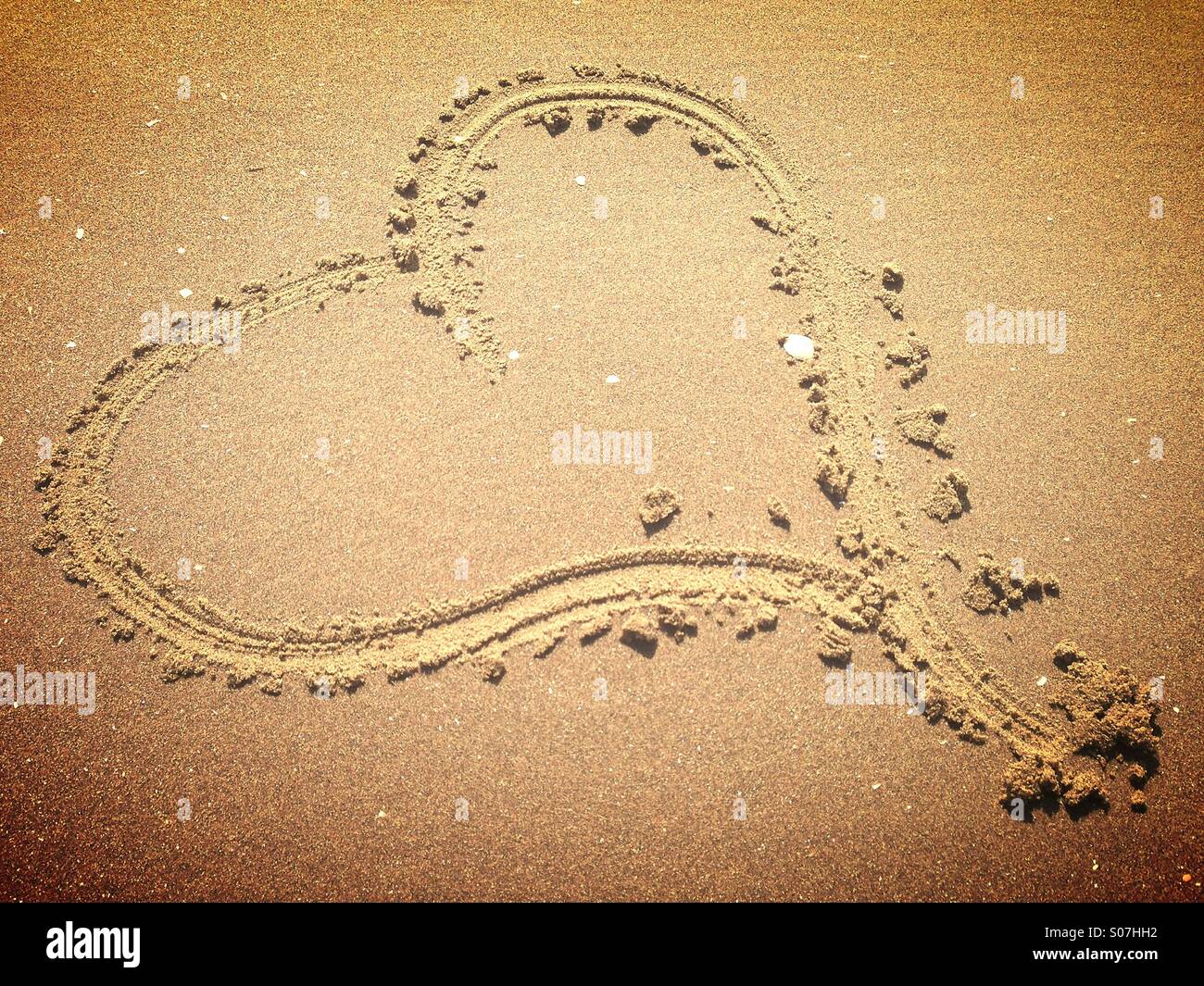 Heart on sand hi-res stock photography and images - Alamy