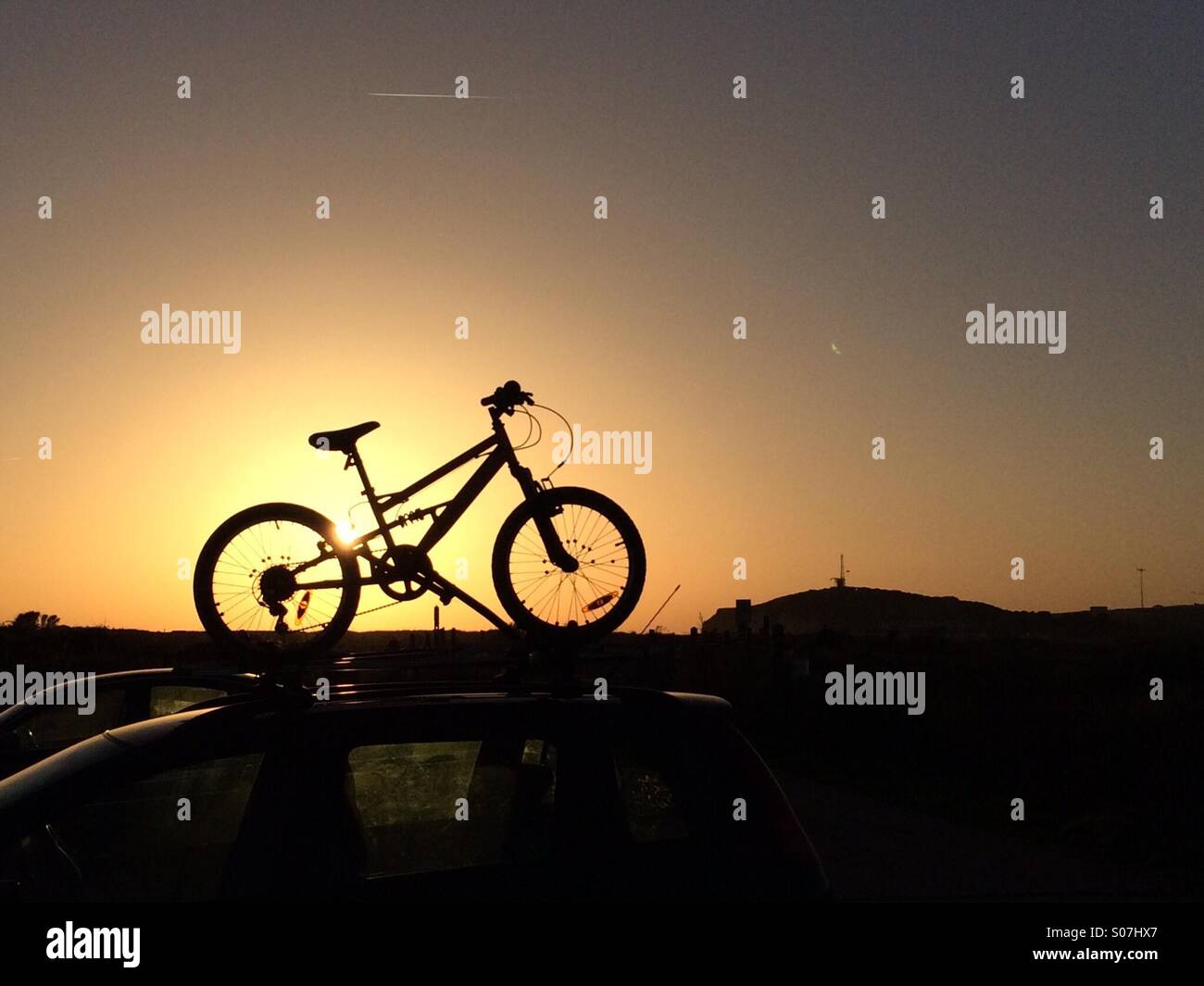 Riding bike sunset hi-res stock photography and images - Alamy