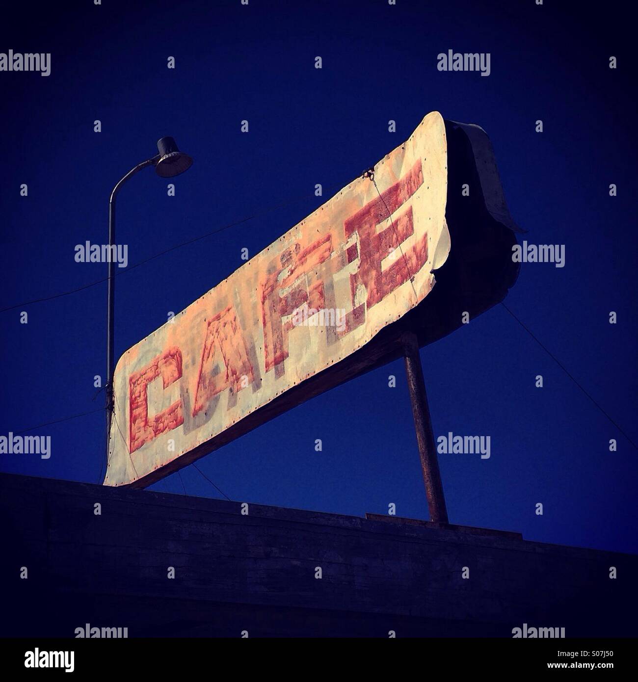 Cafe sign in blue sky Stock Photo - Alamy