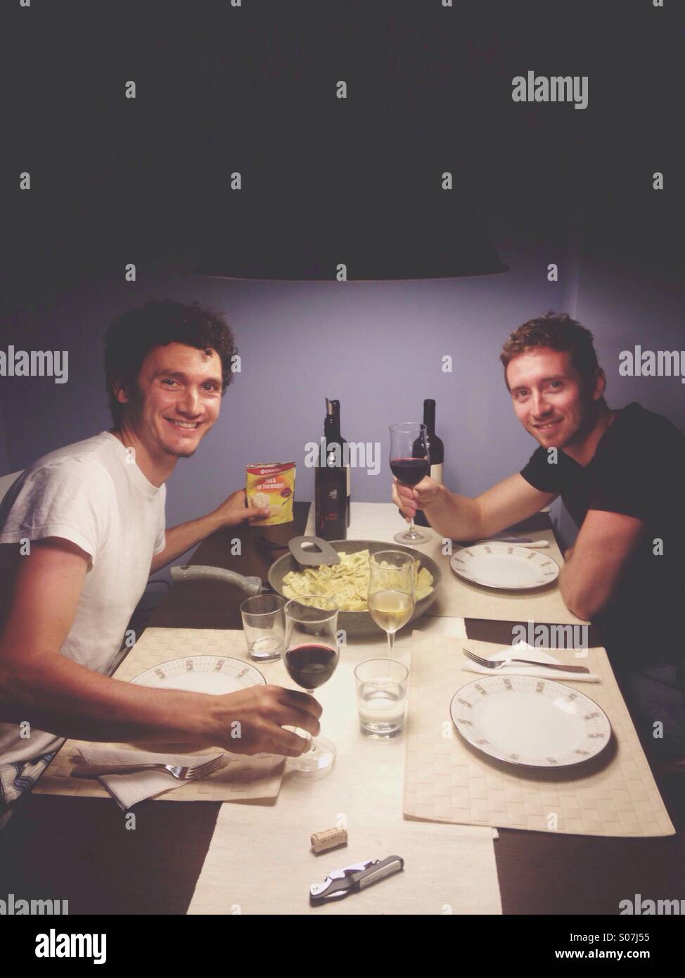 Two men having dinner Stock Photo - Alamy