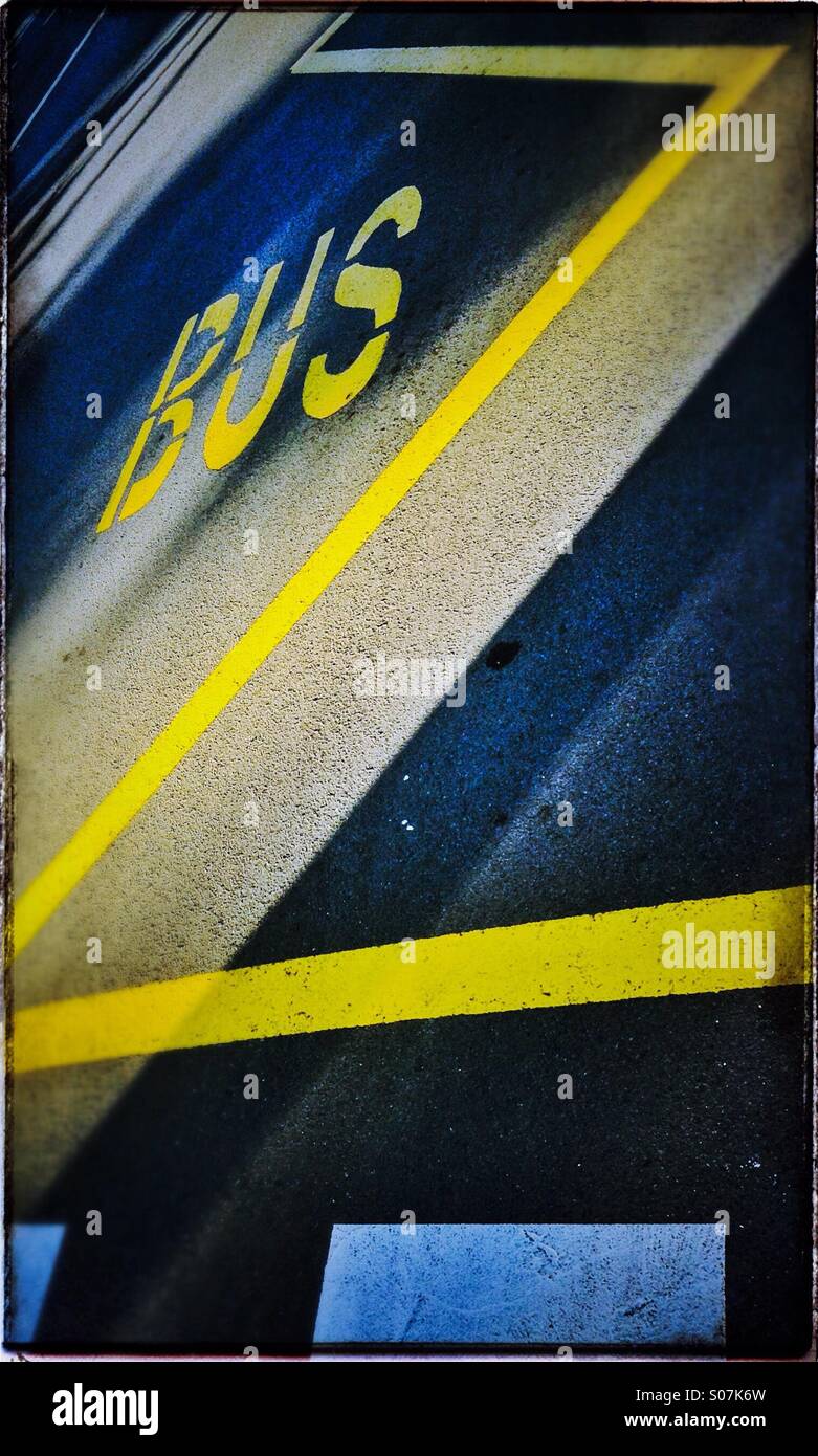 Urban bus stop sign painted on asphalt road in Barcelona, Catalonia ...