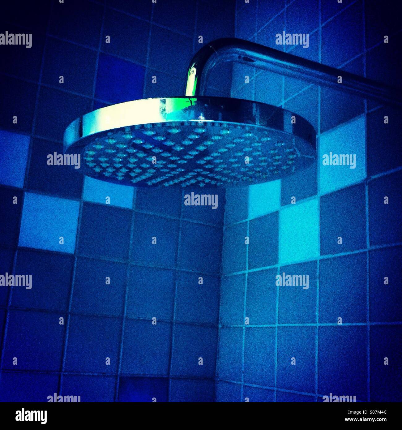 Blue shower head. Rain shower in blue bathroom Stock Photo - Alamy