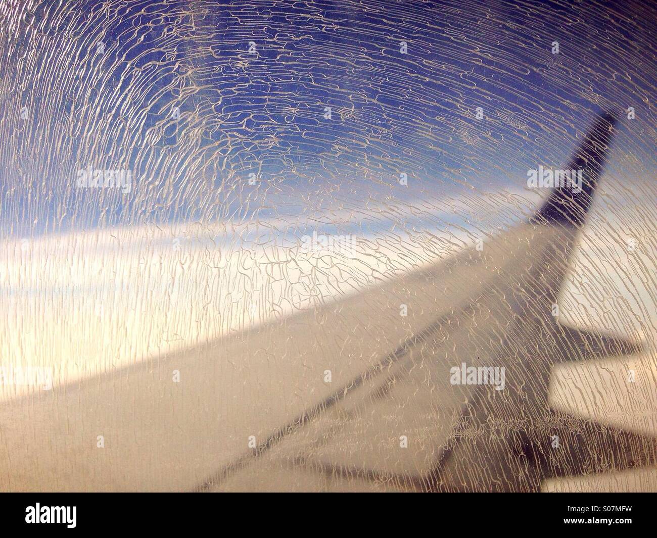 Scratch windows on a plane Stock Photo - Alamy