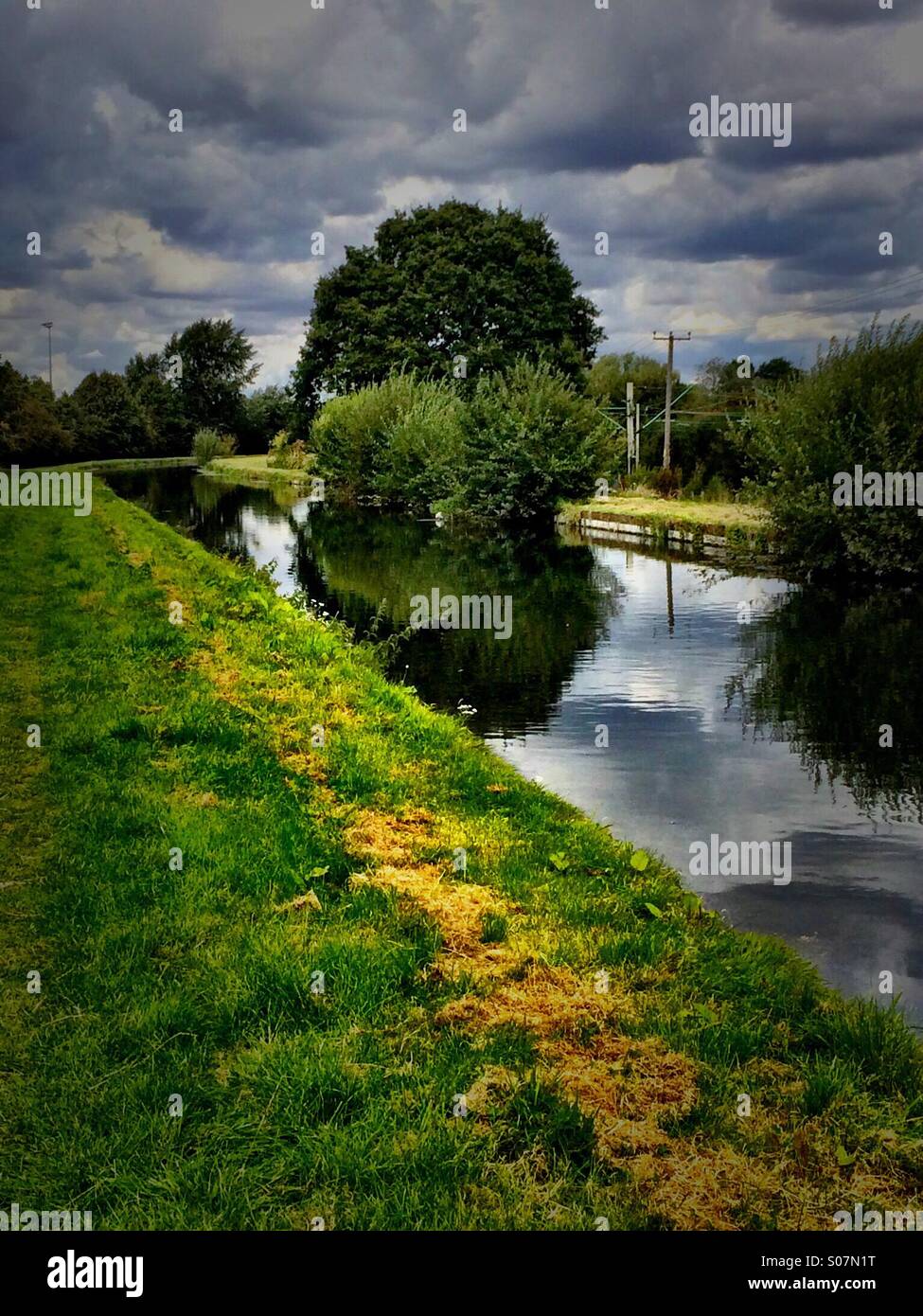 Walking on the towpath by the river Stock Photo - Alamy