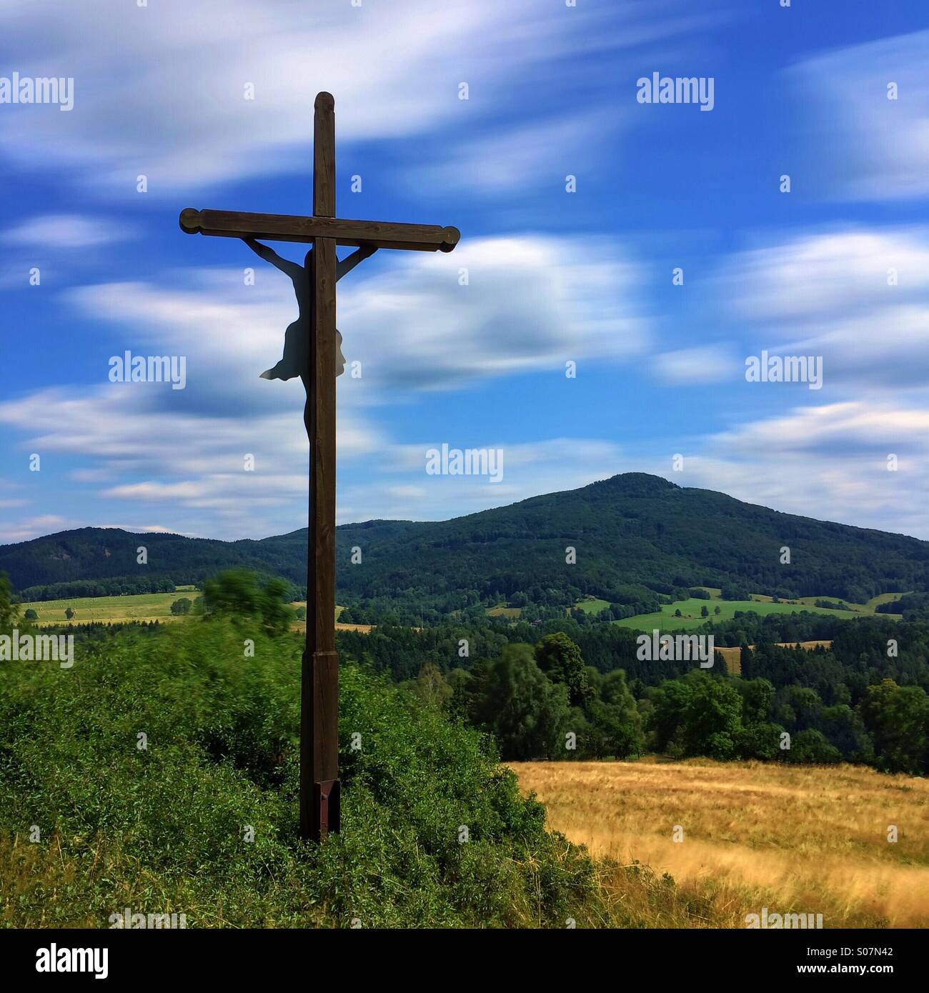 Landscape with a big cross Stock Photo - Alamy