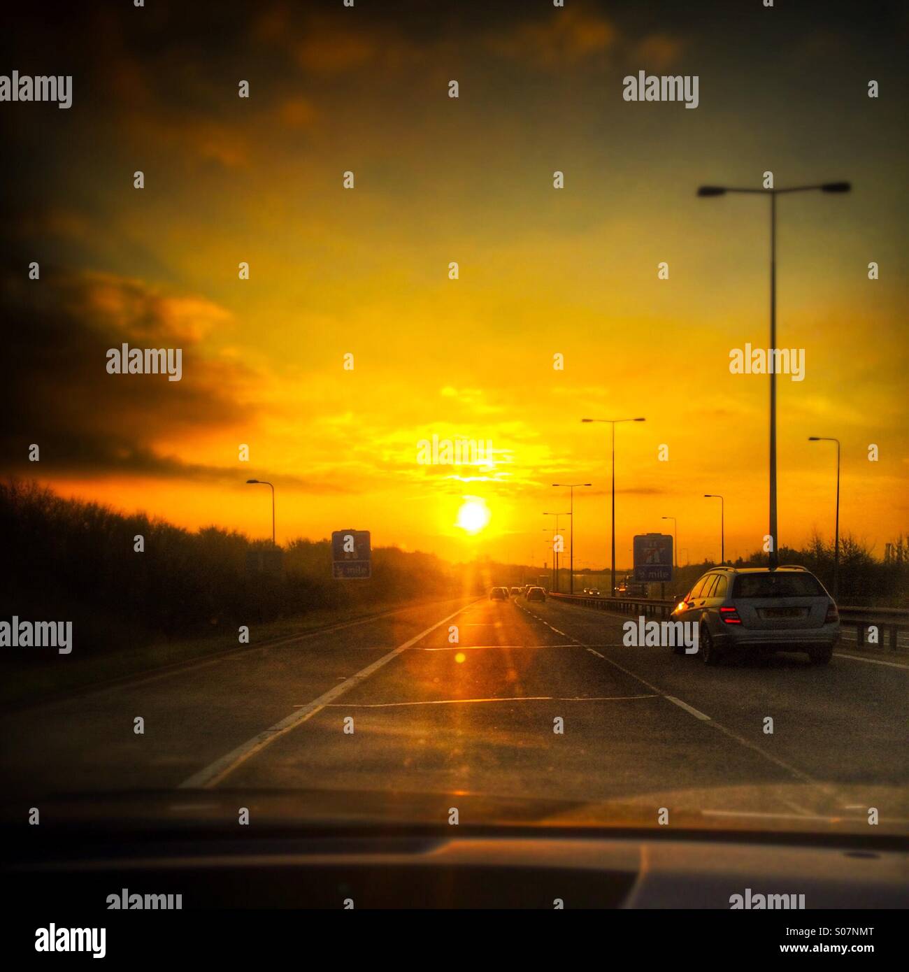 Driving into the sun Stock Photo - Alamy