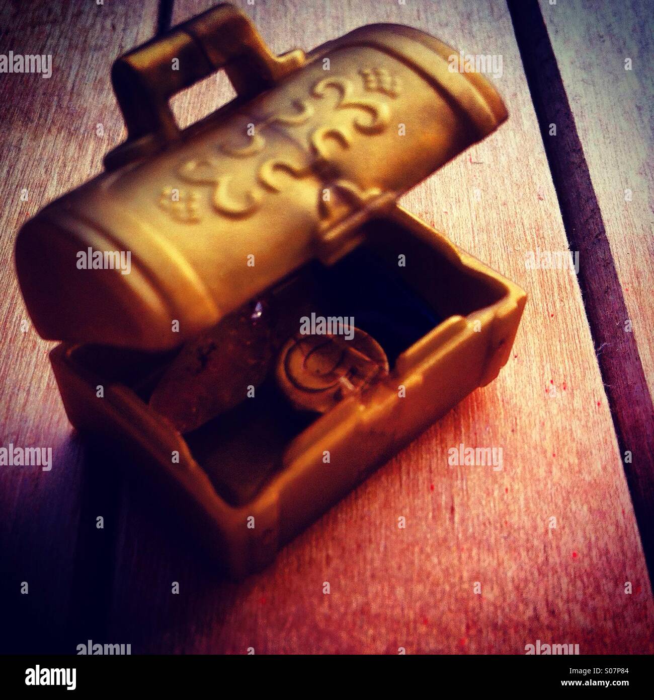 Gold coin in treasure chest Stock Photo - Alamy