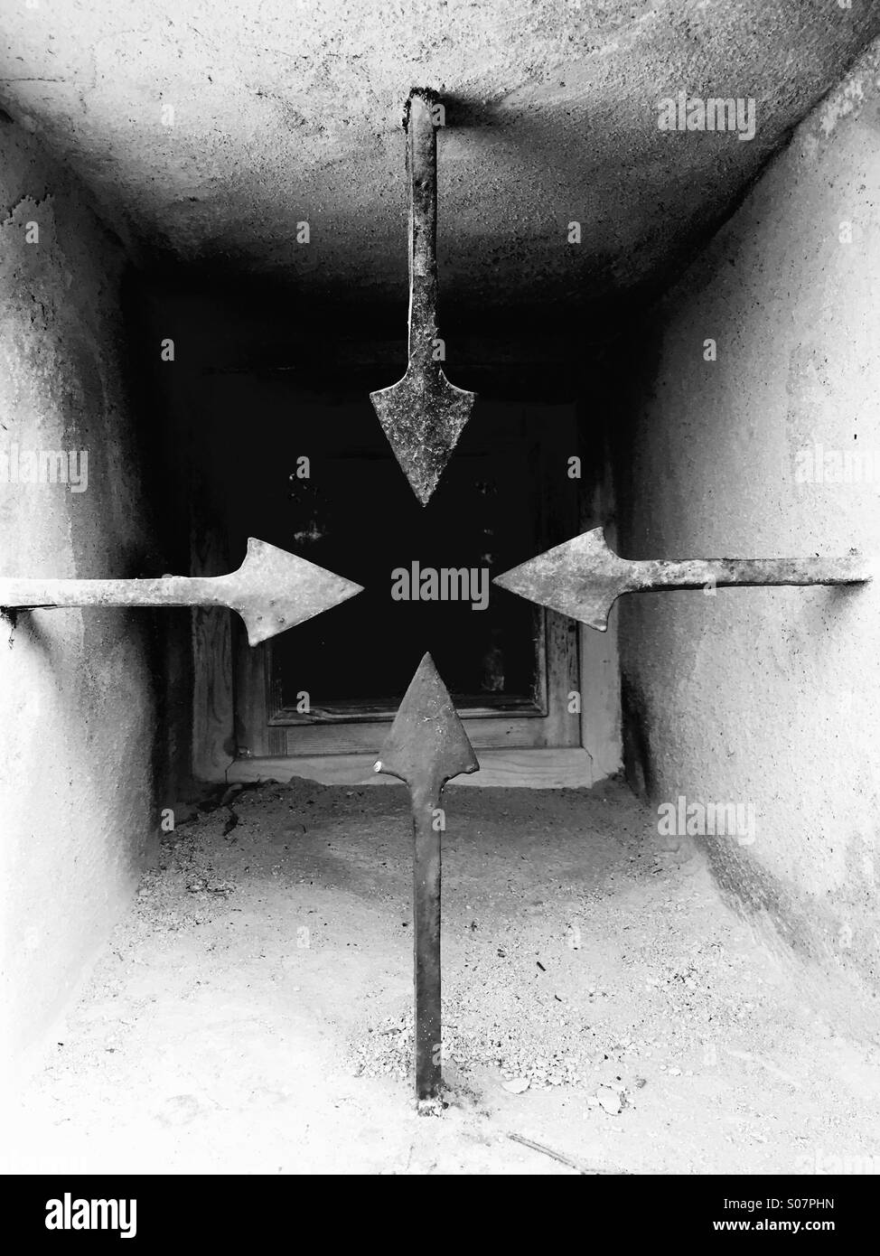 Sharp iron arrows pointing to a central position in black and white ...