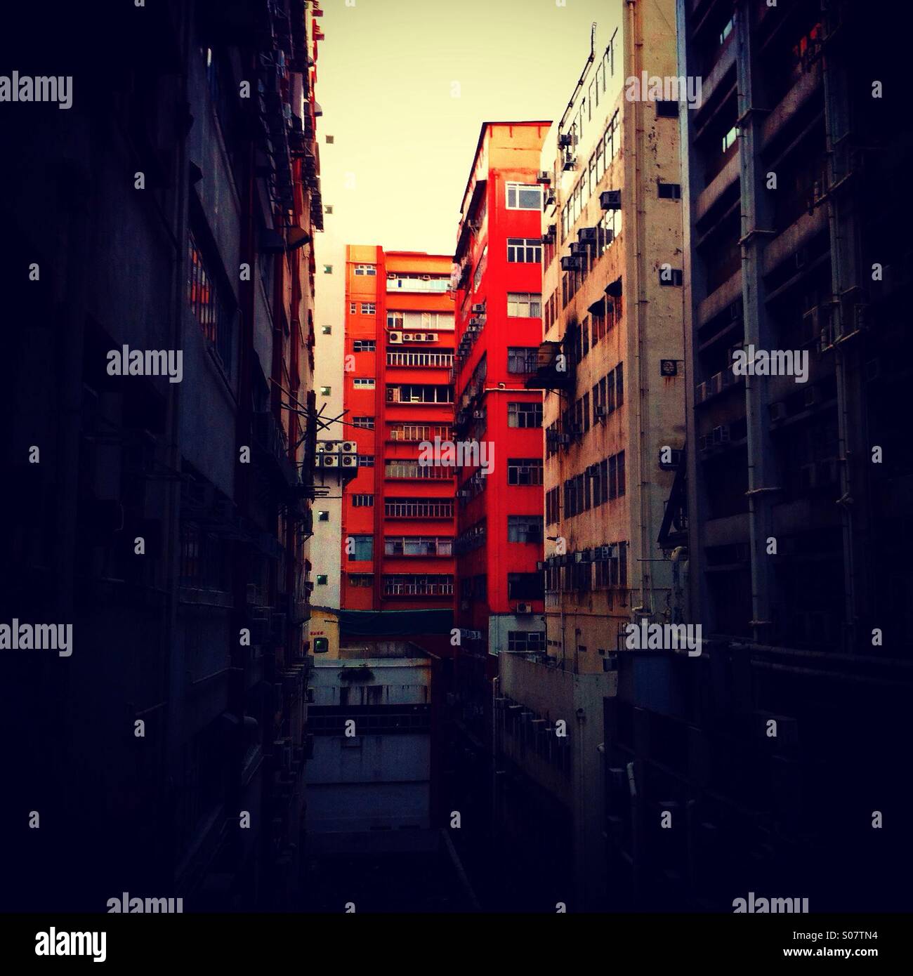 Red building in dark street Stock Photo - Alamy