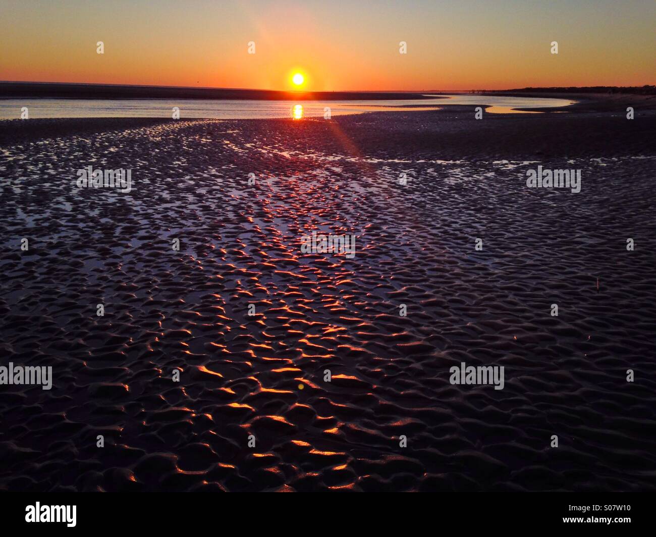 Sunset light shines on a sandbar at Kiawah Island, SC Stock Photo - Alamy