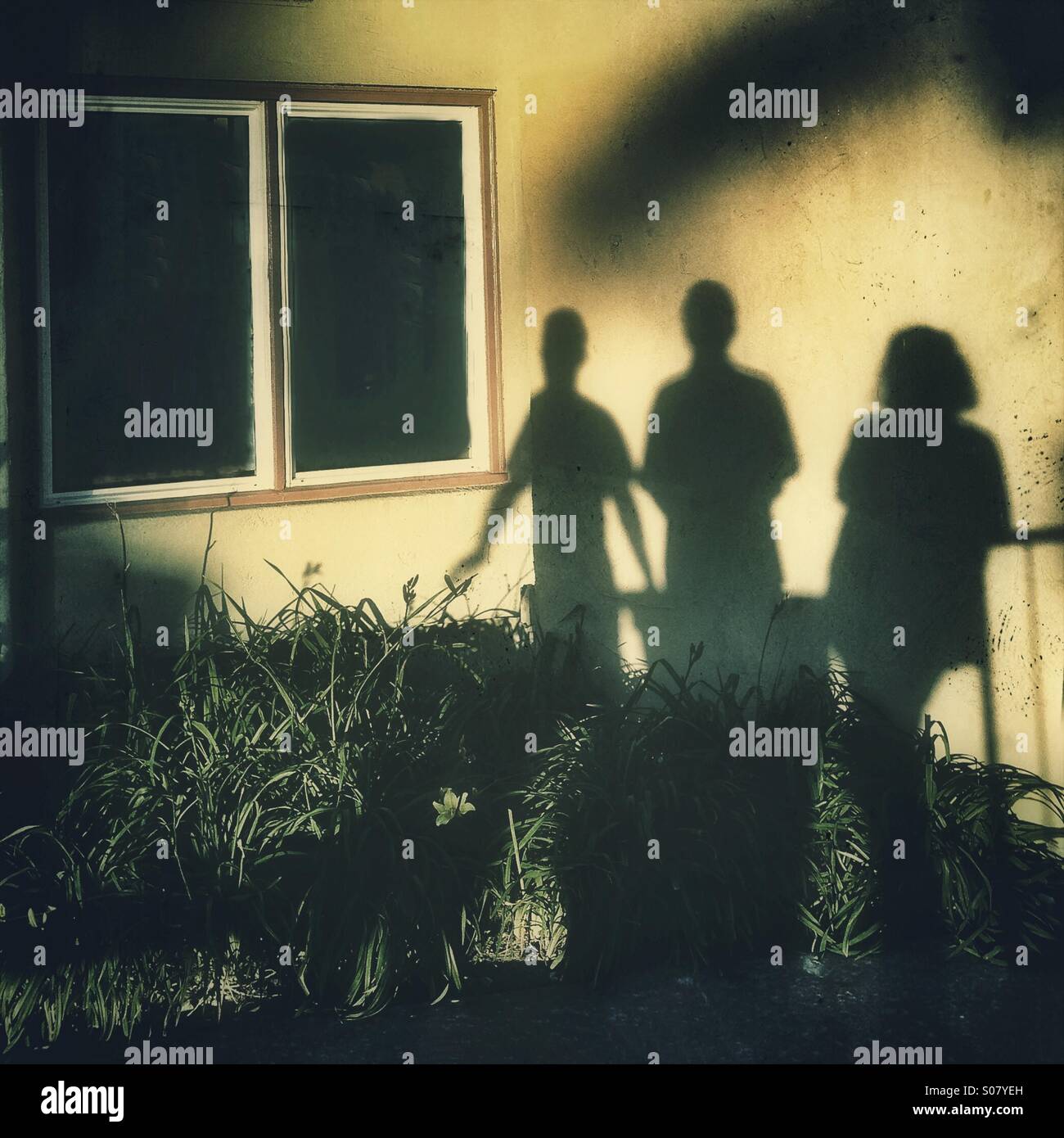 Man woman and child shadows hi-res stock photography and images - Alamy