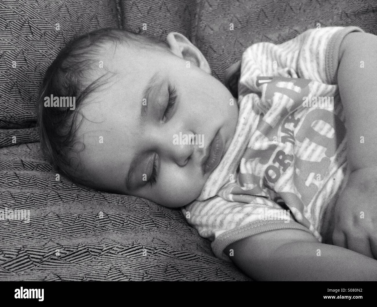 Precious sleeping baby black white hi-res stock photography and images ...