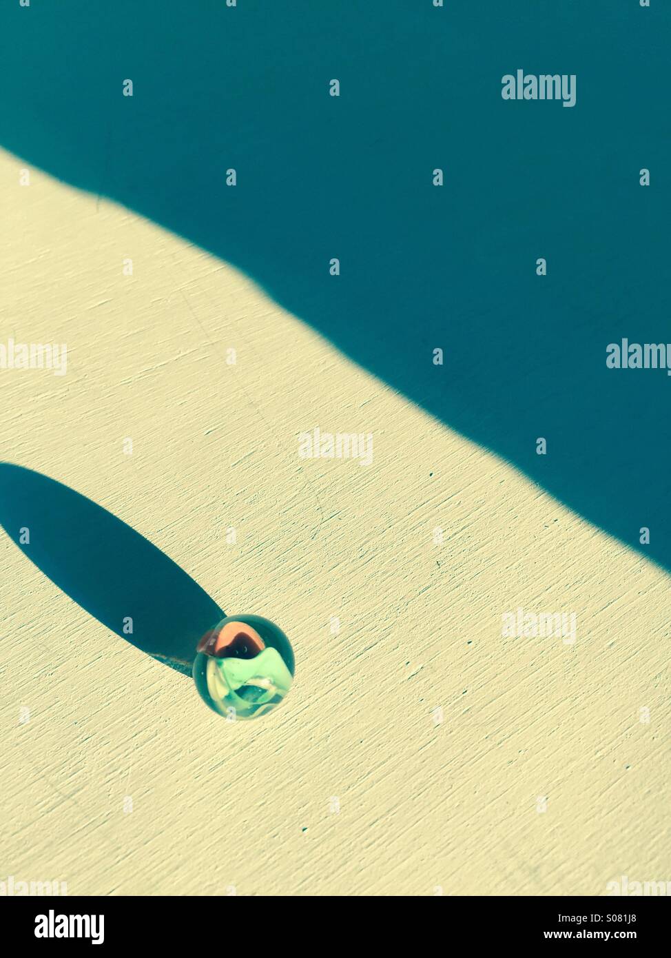 Graphic still life image of a marble casting a shadow Stock Photo - Alamy