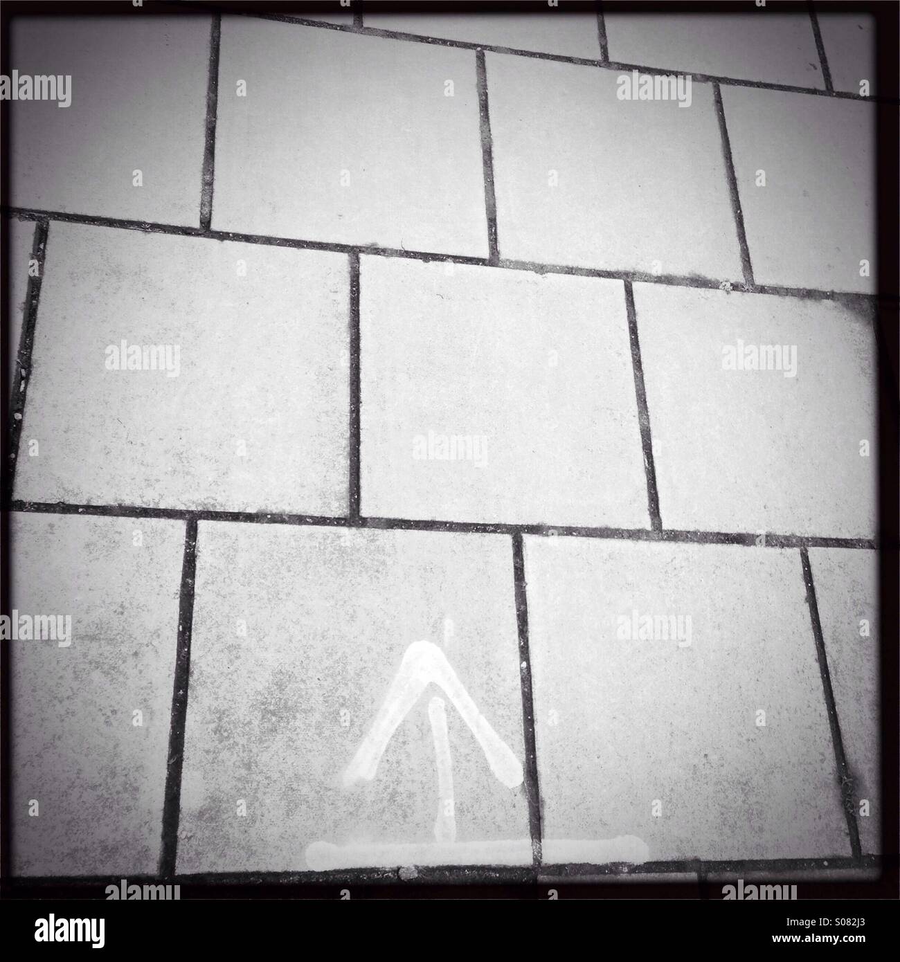 Painted arrow on pavement Stock Photo - Alamy