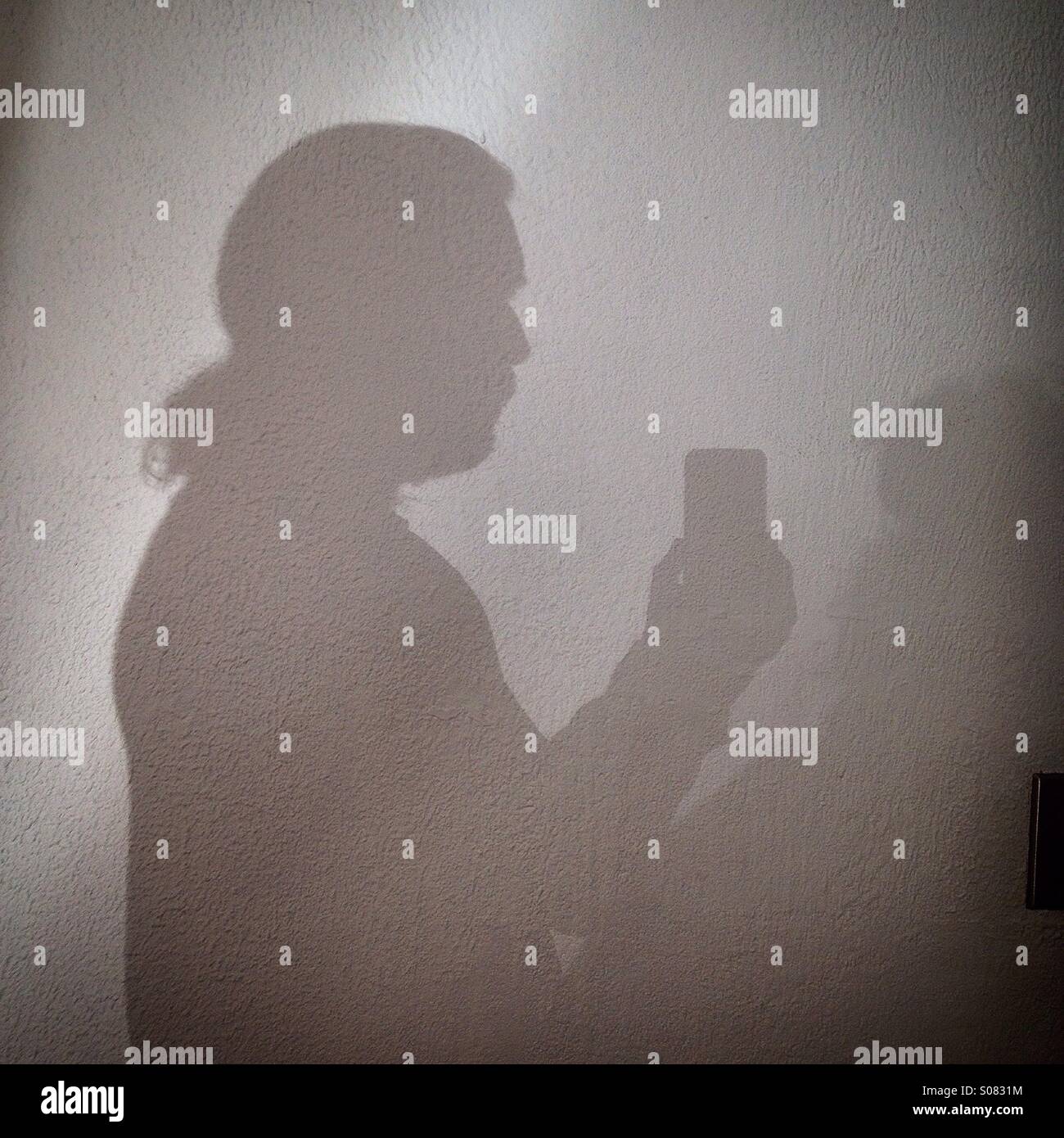Shadow cast silhouette of a person taking a picture in Colonia Roma ...