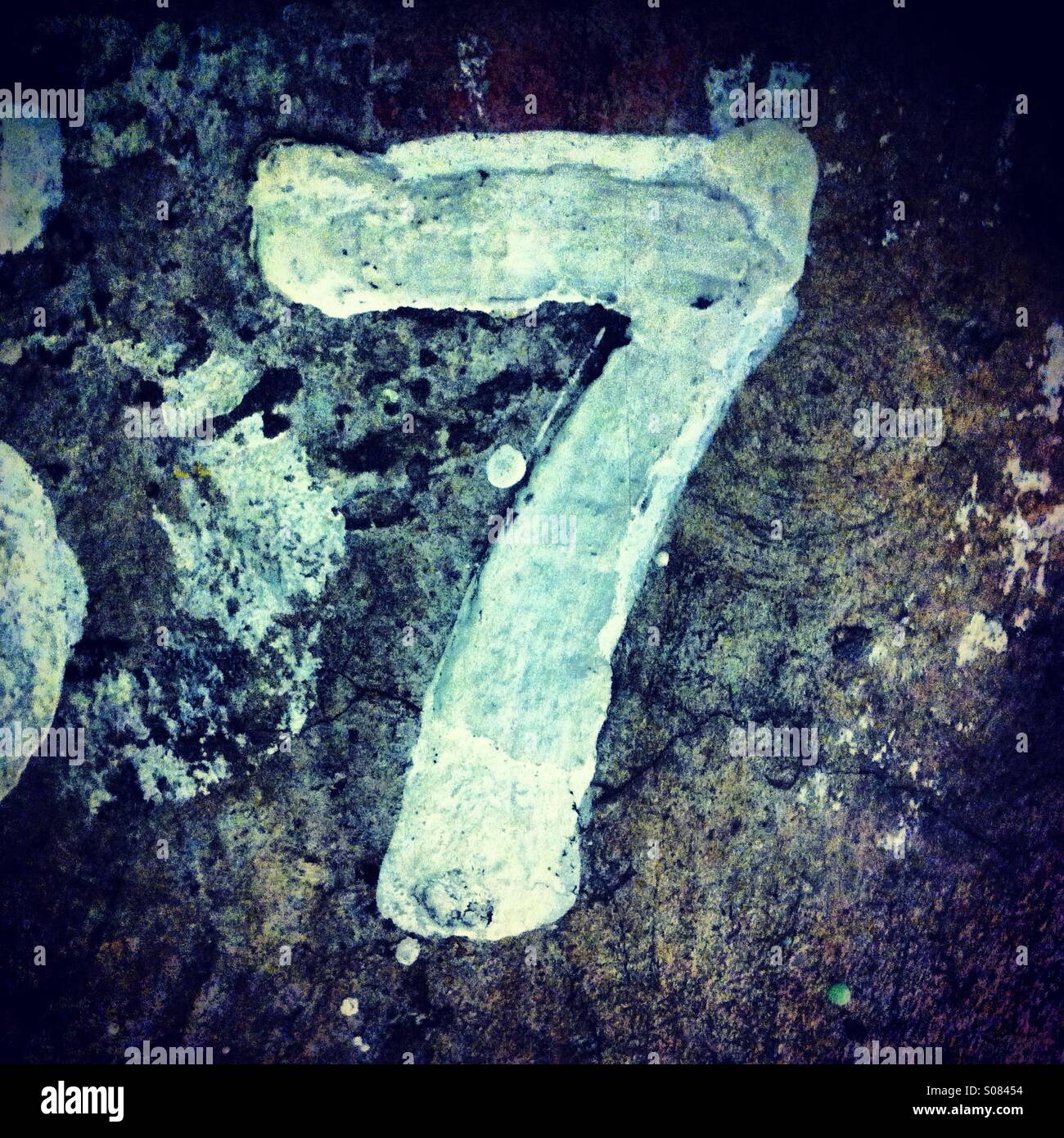 Rough number 7 painted in white color Stock Photo - Alamy