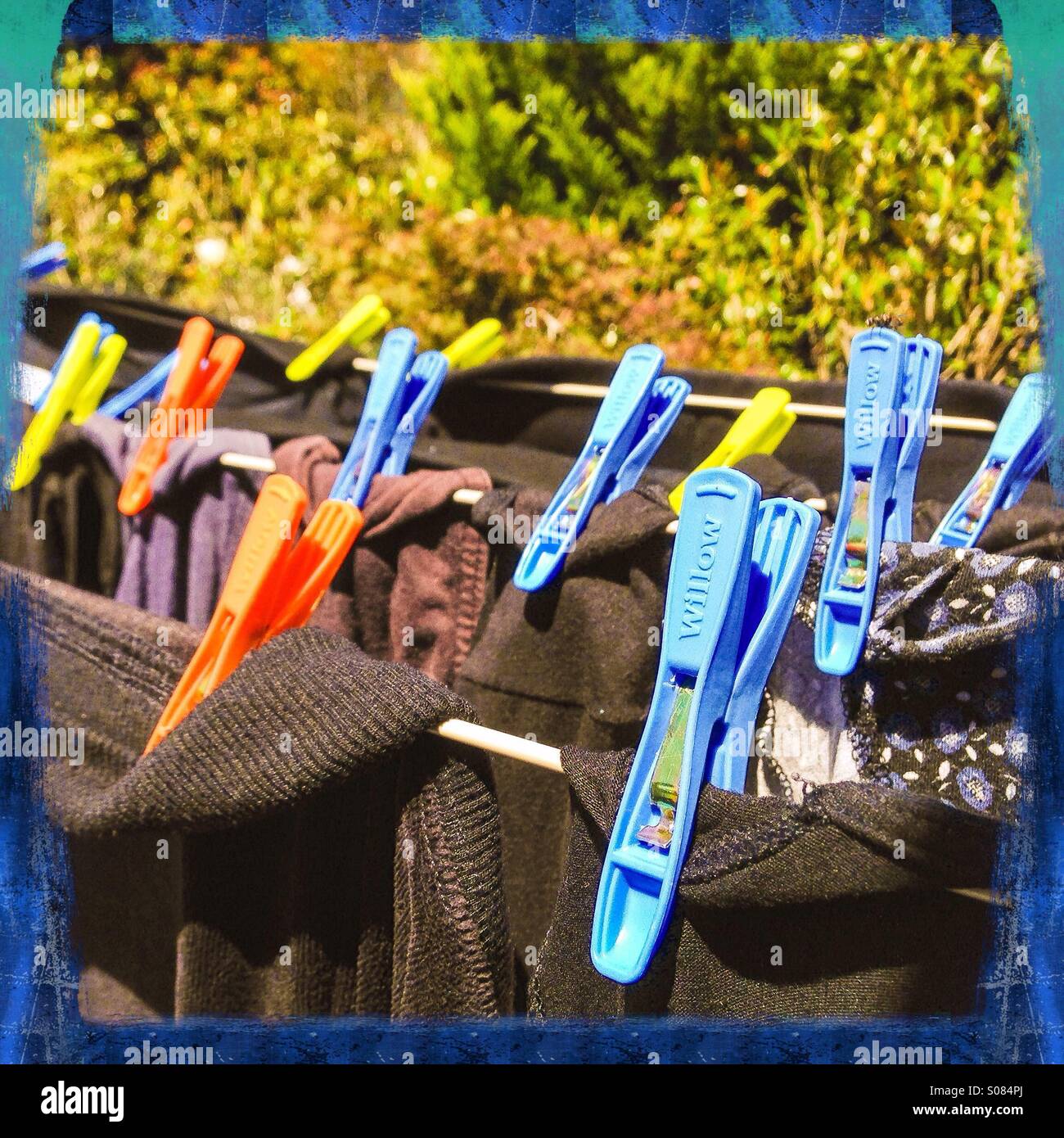 Washing pegs and clothes hanging on washing line Stock Photo - Alamy