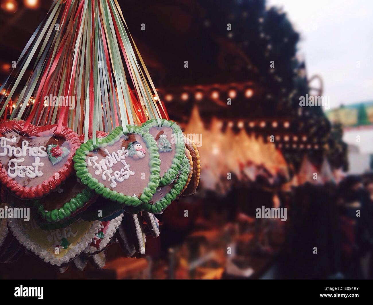 Sweets hanging on Christmas market stall Stock Photo - Alamy