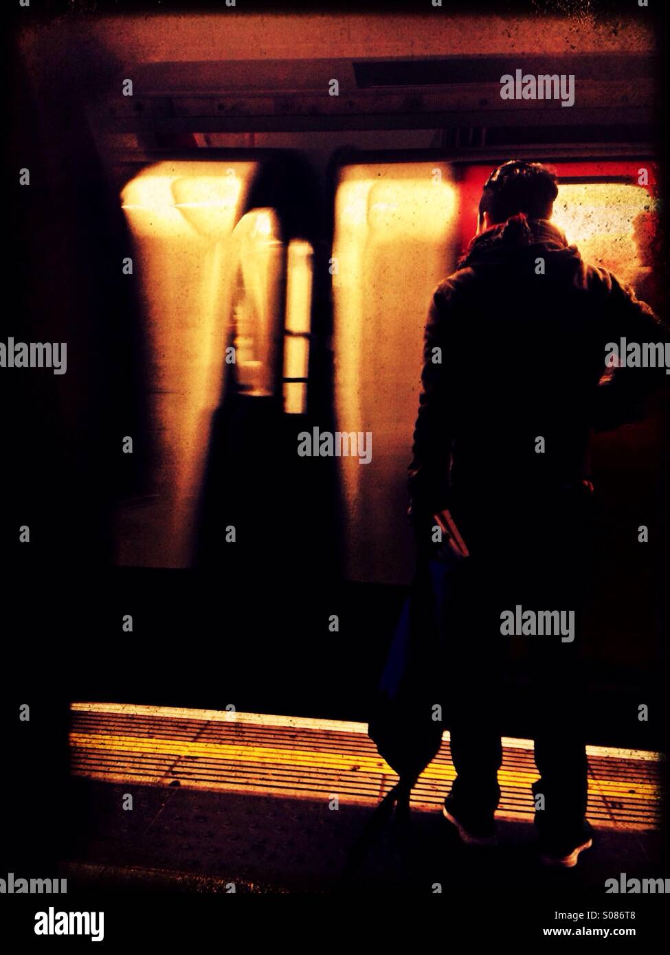 Tube platform showing passing train, Central London, UK Stock Photo - Alamy