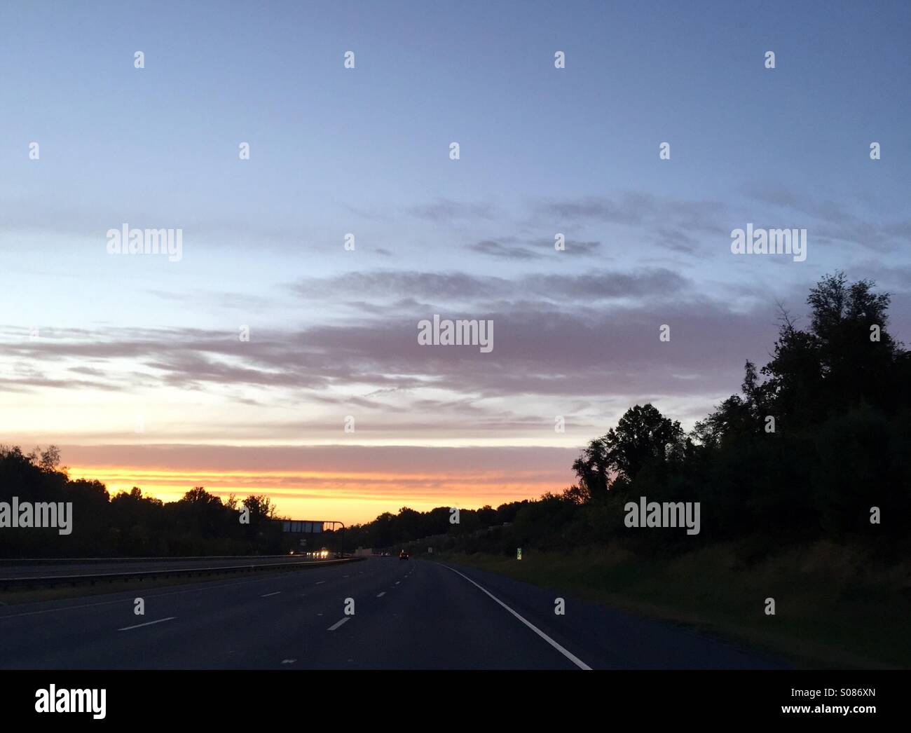 Open road and sunset Stock Photo - Alamy