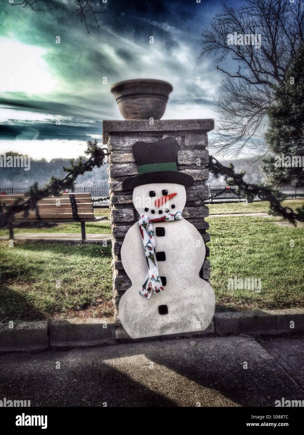 A snowman display in a small park Stock Photo - Alamy