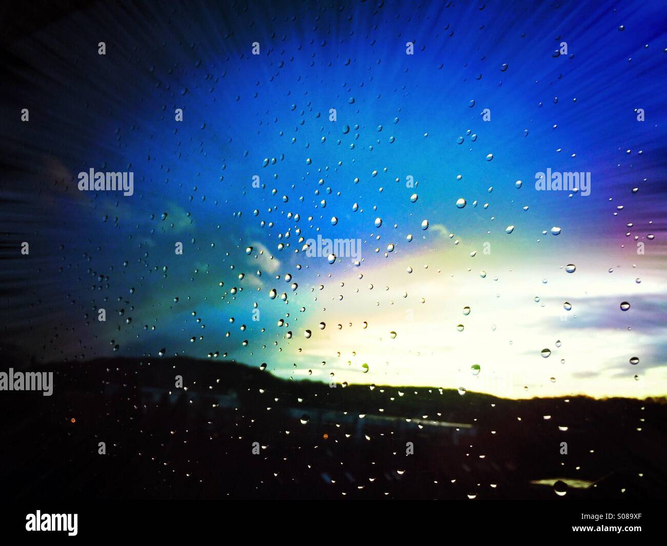 Water droplets on window in front of evening sky Stock Photo - Alamy