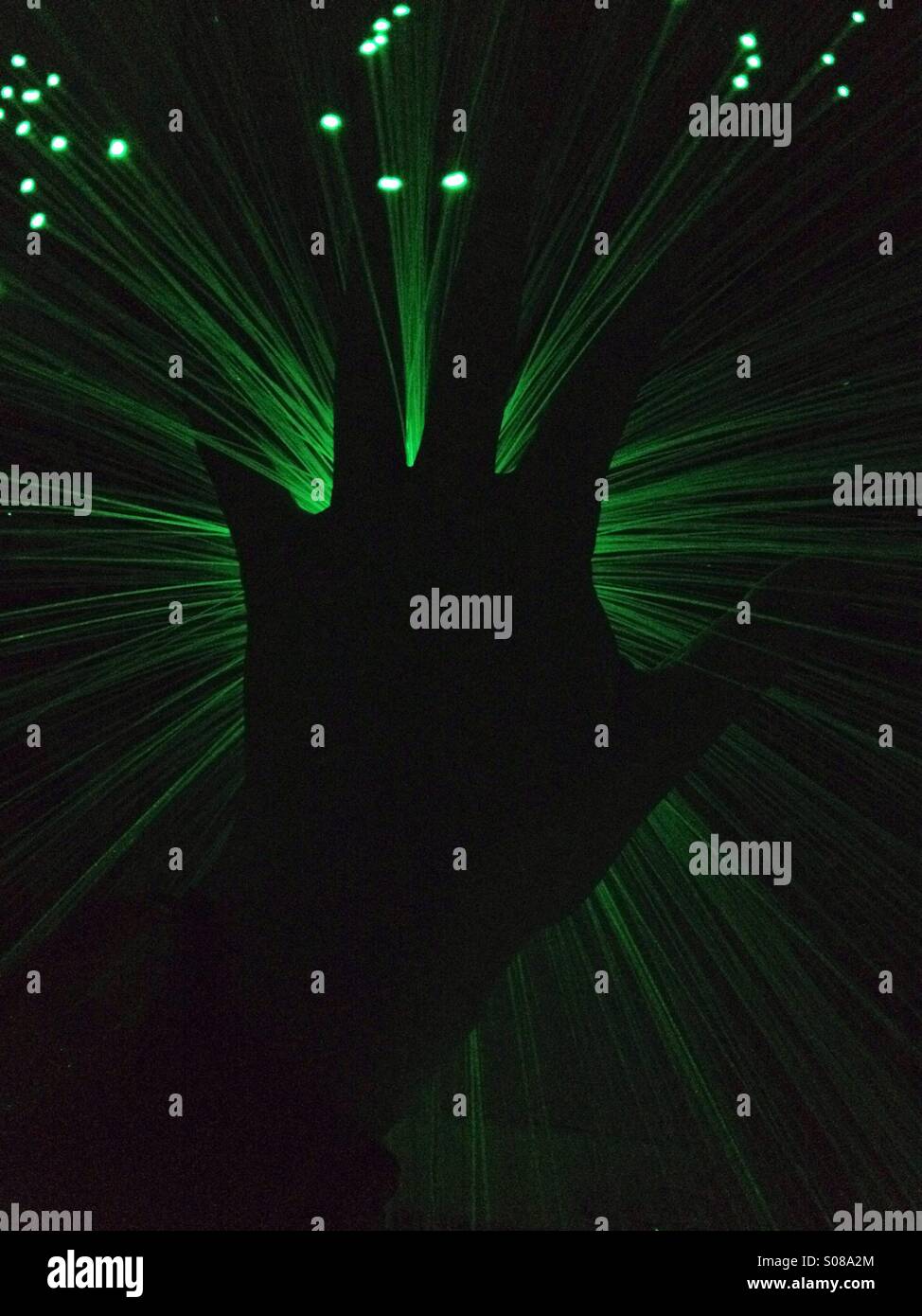 Hand silhouette on fibre optic lights Stock Photo - Alamy