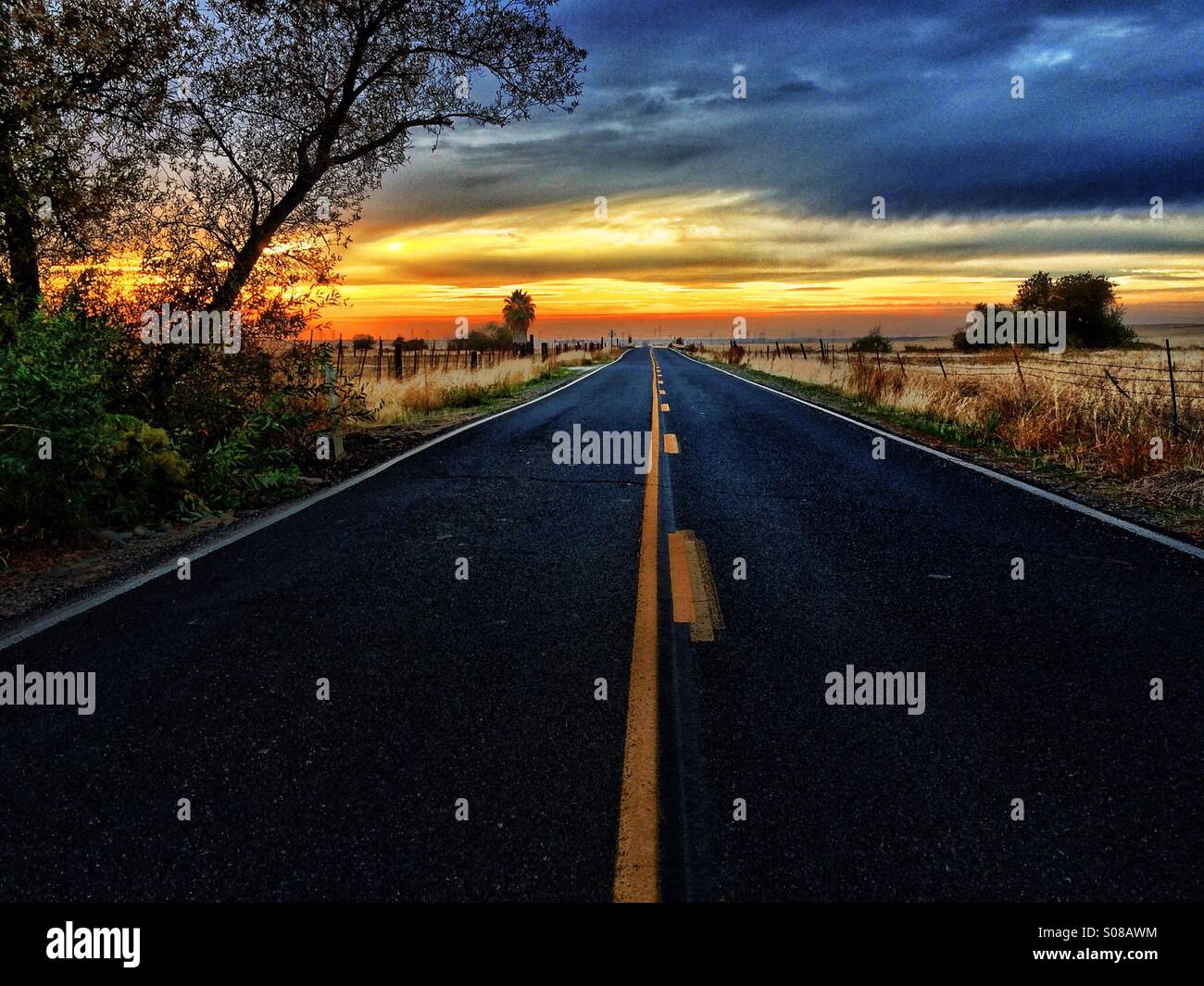 Road Into the Sunset Stock Photo - Alamy