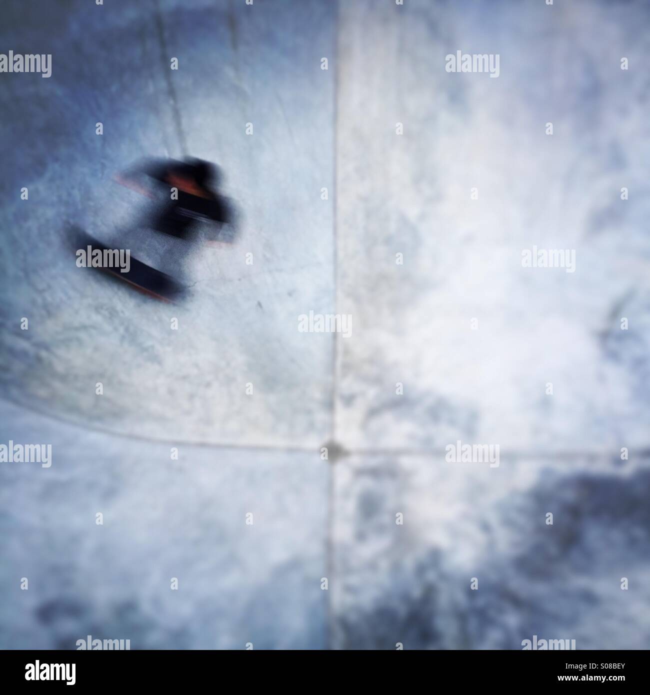 Skateboarder rides in a pool at a skate park Stock Photo - Alamy