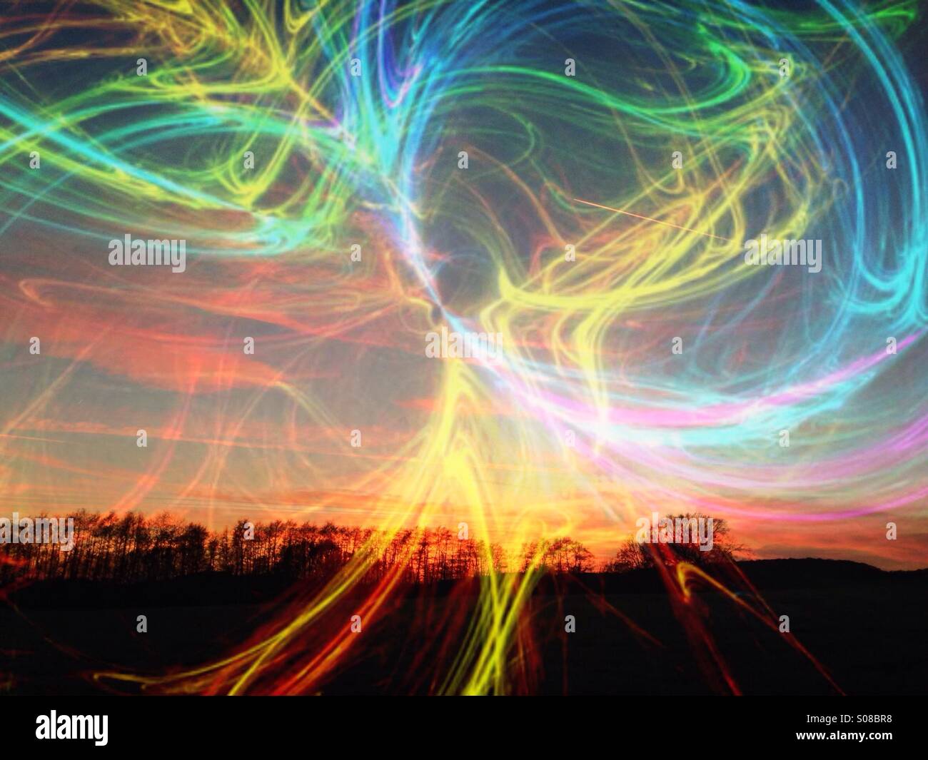 Sunset over a Forest Stock Photo - Alamy