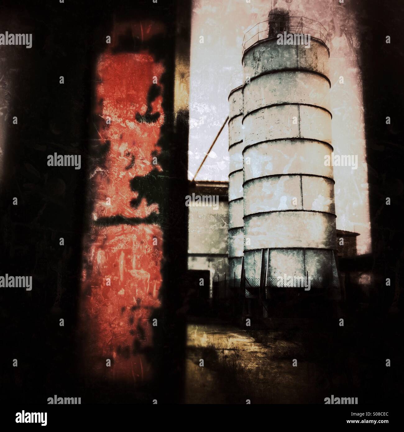 Old silo through a gate Stock Photo - Alamy