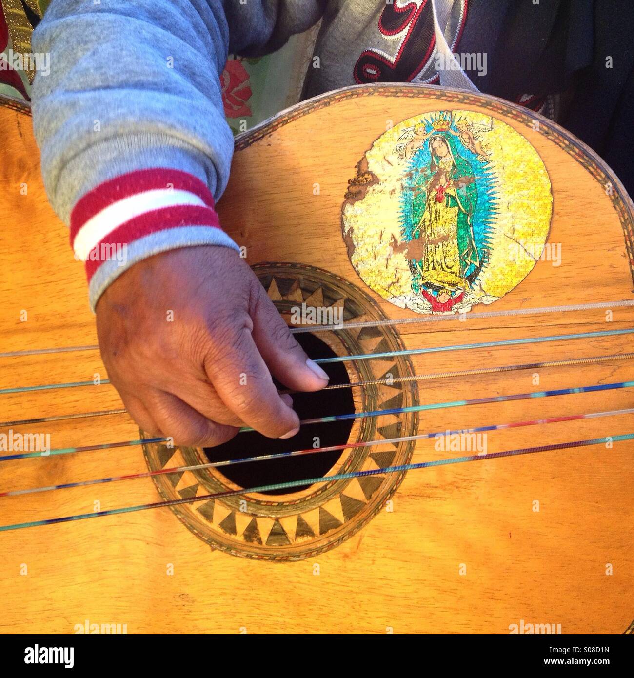 A bass guitar player plays with his instrument during the pilgrimage to ...