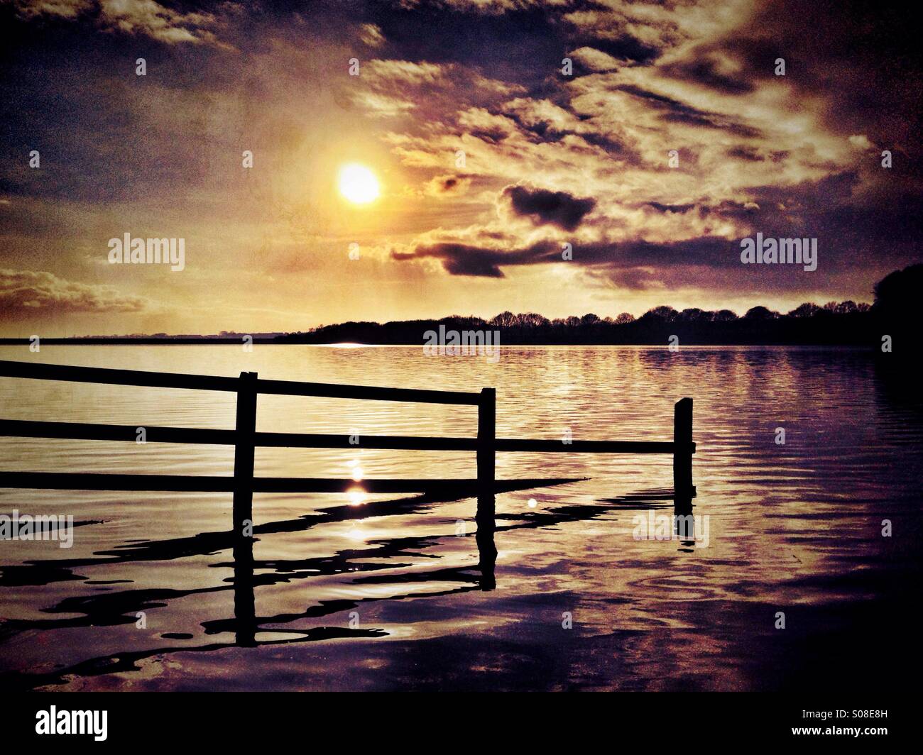 Fence submerged in reservoir Stock Photo - Alamy