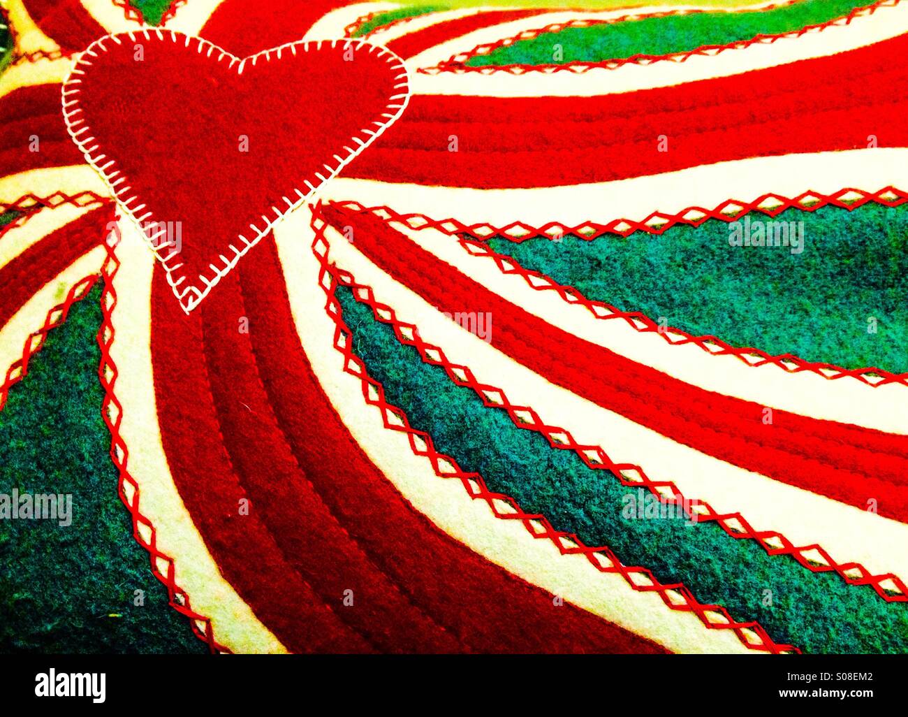 Colourful fabric with heart shaped emblem Stock Photo - Alamy