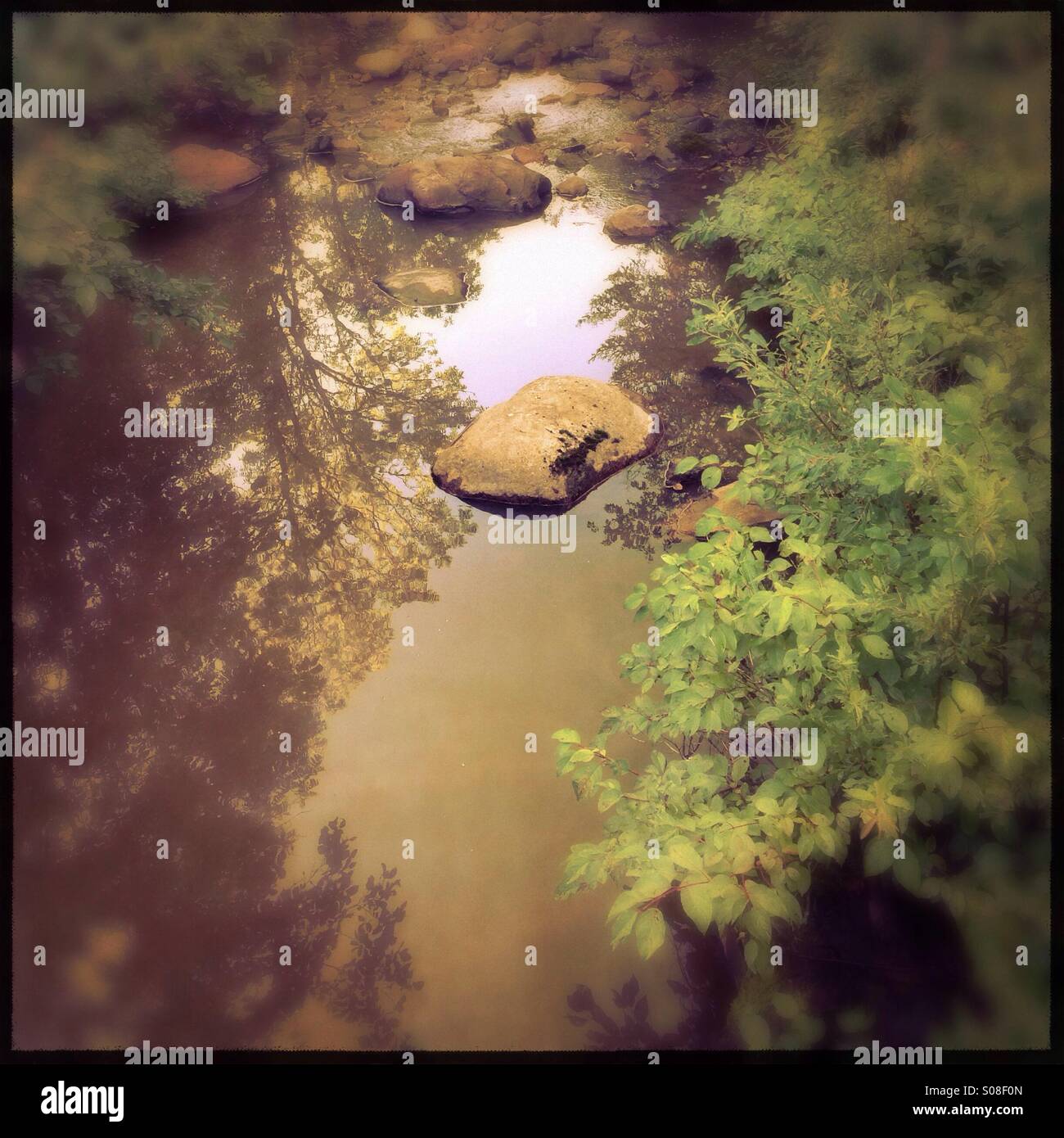 Rock in stream Stock Photo - Alamy