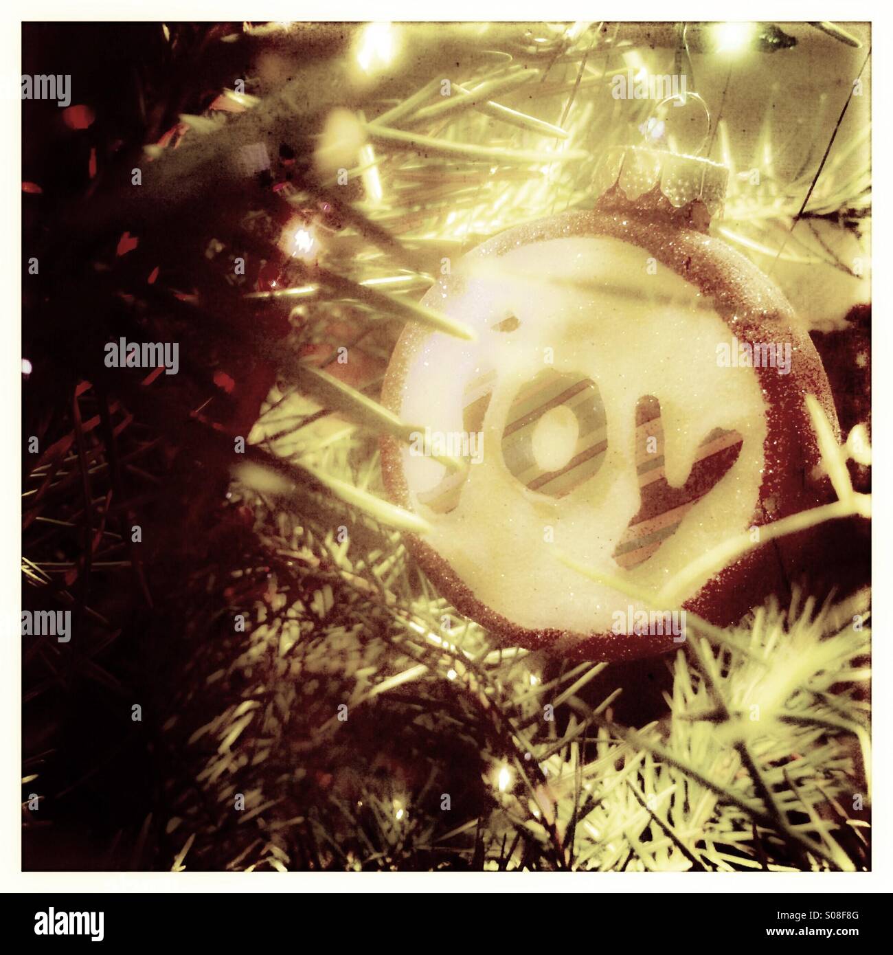 A Christmas tree ornament that says joy on a Christmas tree Stock Photo ...